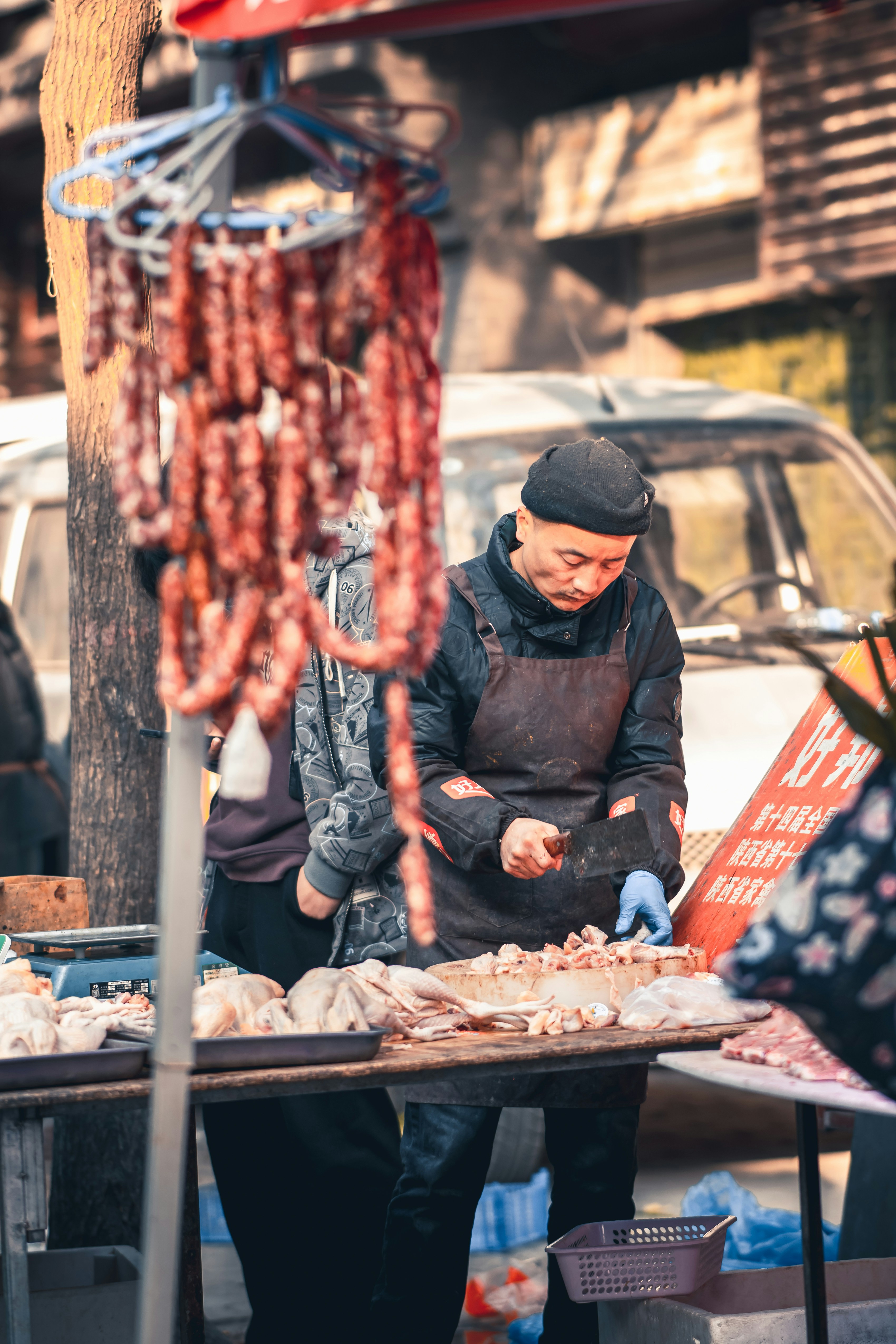 Butcher's Focus: Crafting Cuts Under Warm Market Light
