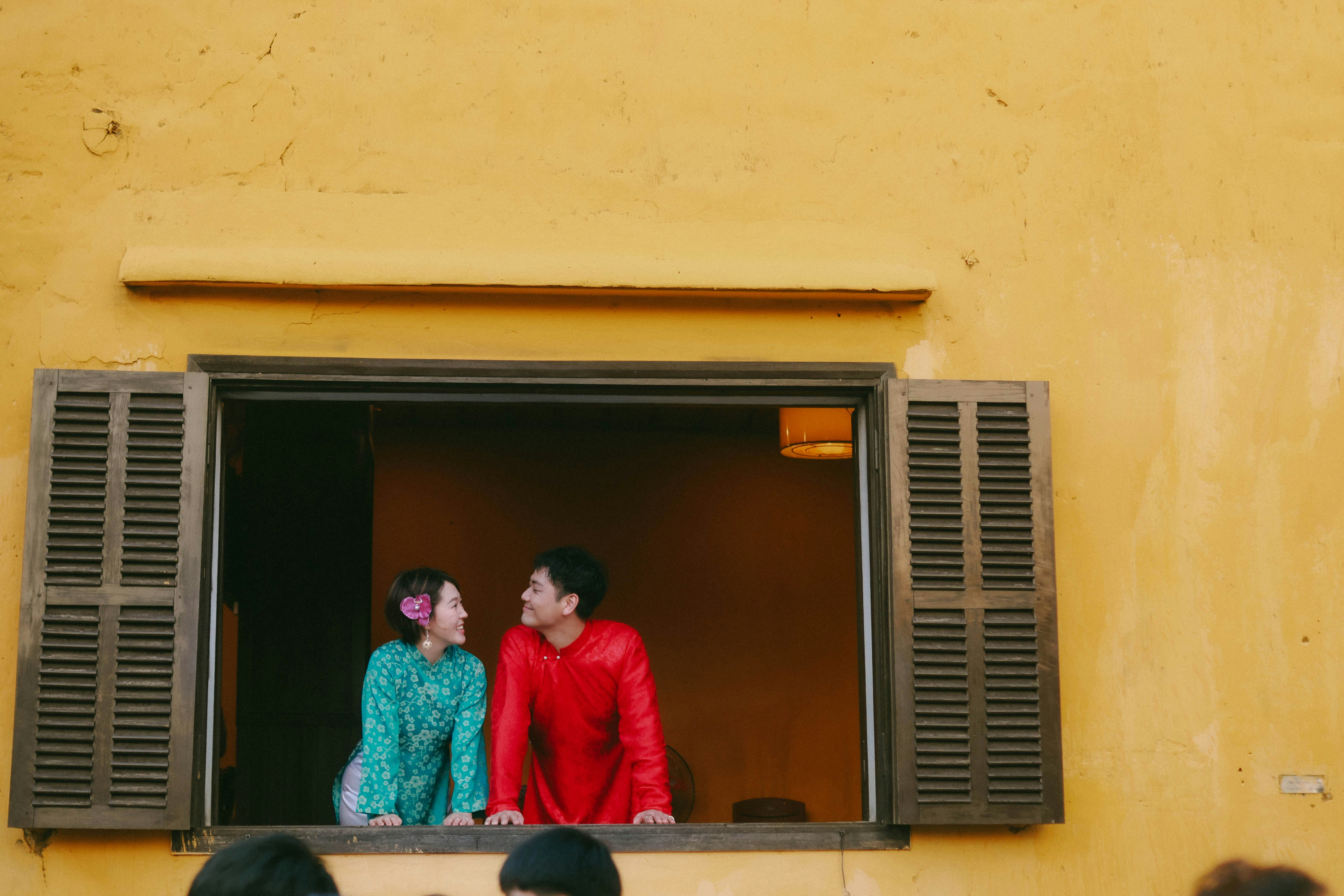 Colorful Conversation at a Sunlit Balcony