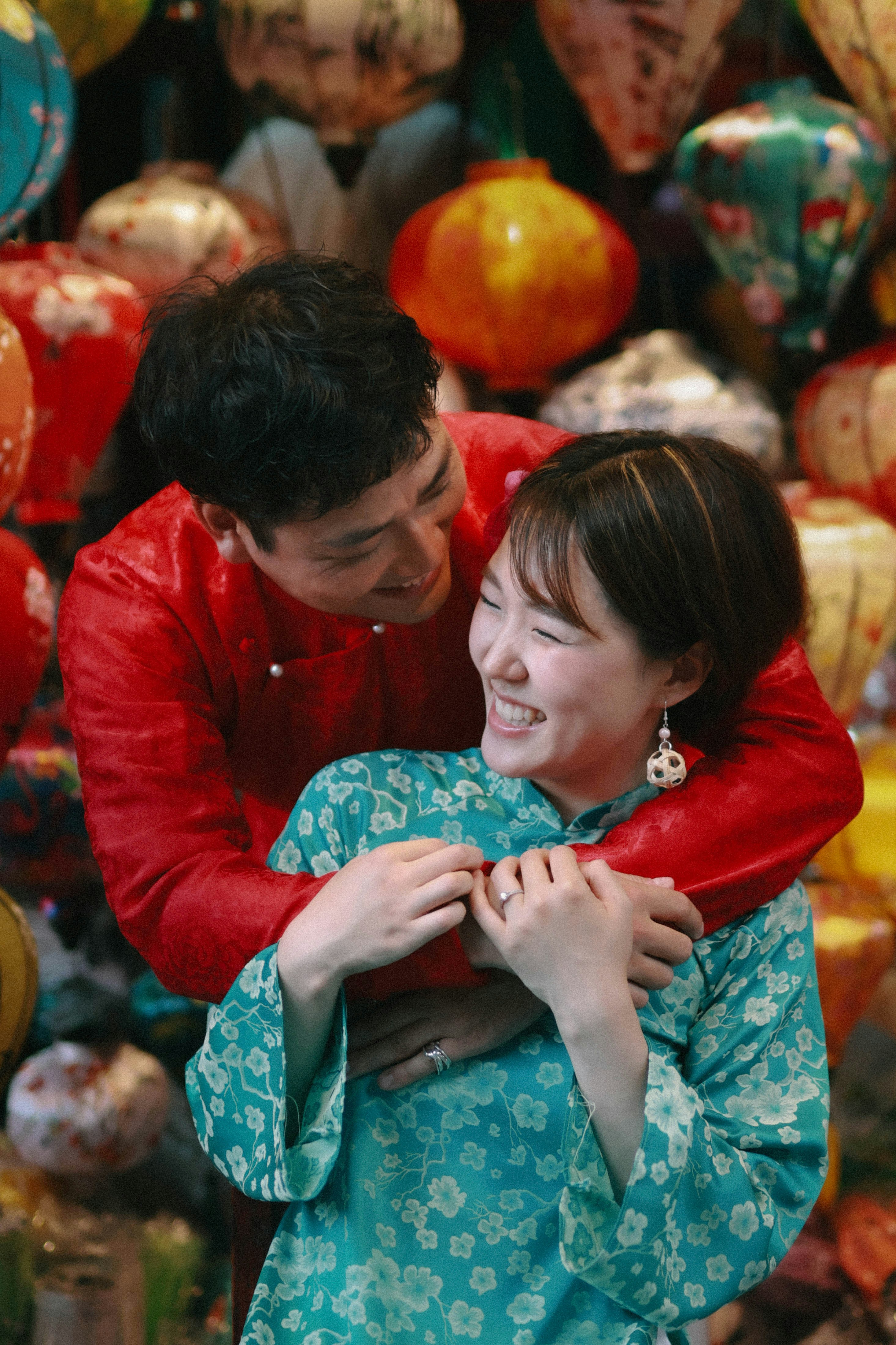 Warm Embrace Among Lanterns: A Moment of Shared Joy