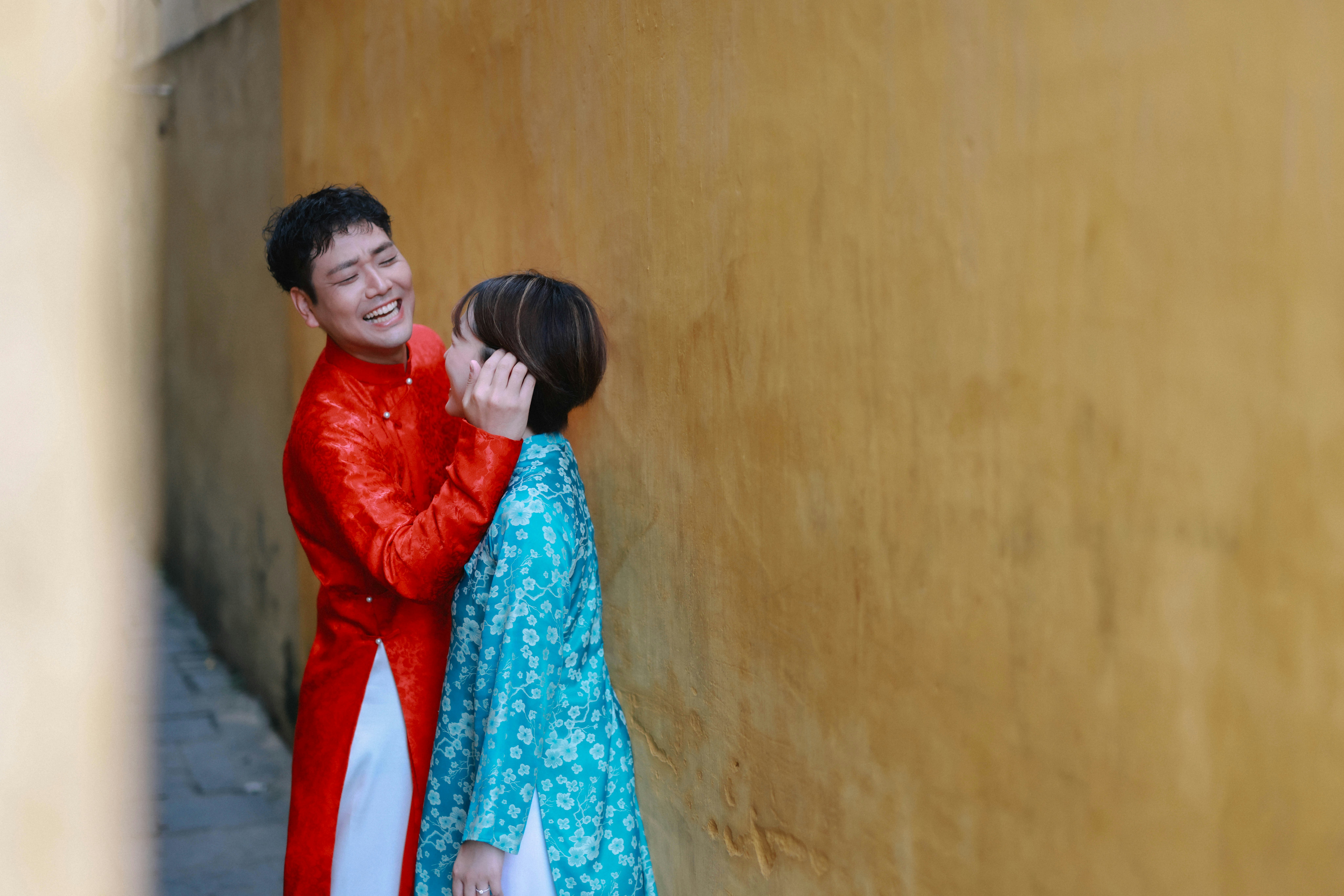 Red and Aqua: A Quiet Moment Between Veiled Walls