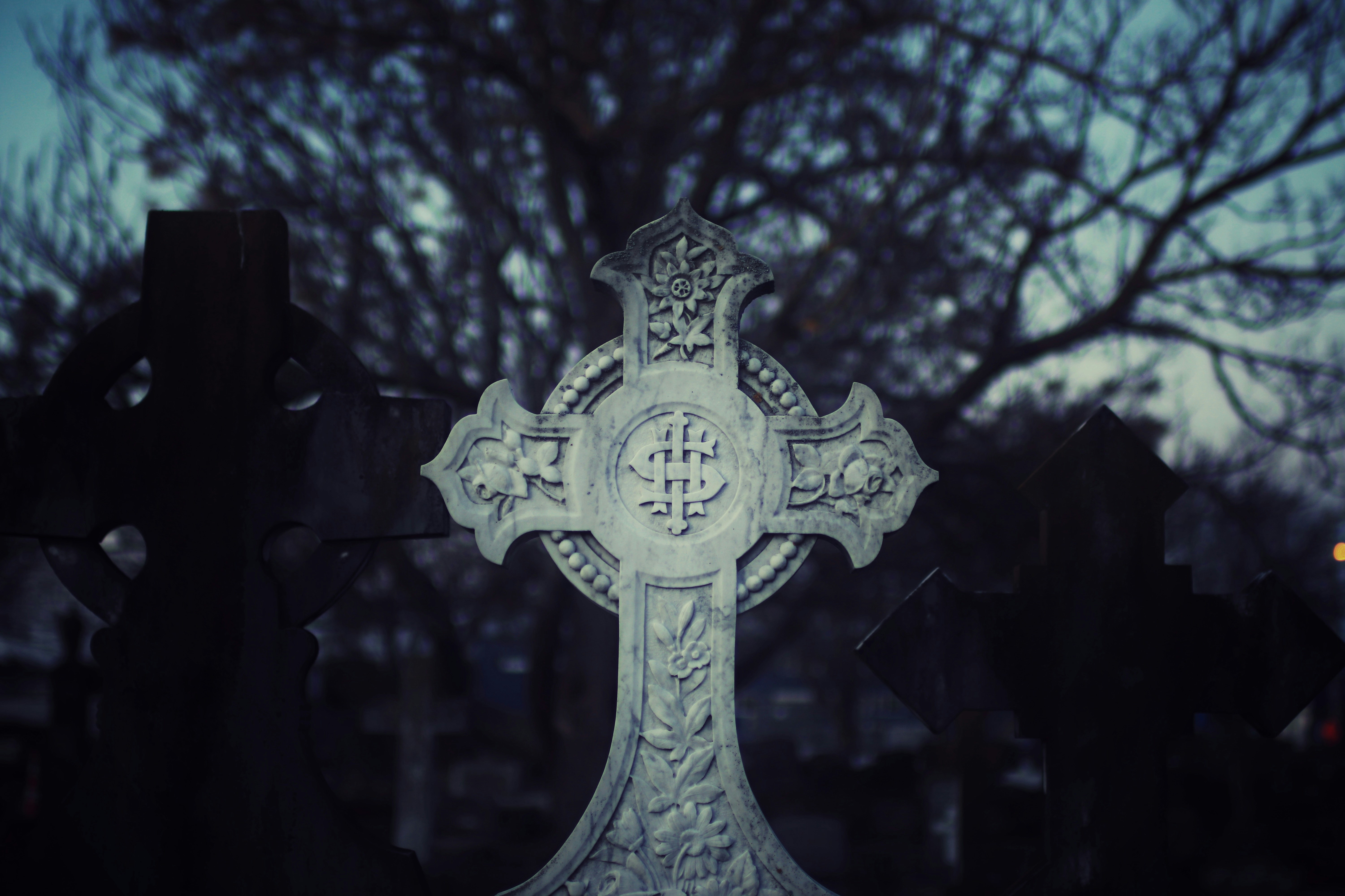 Centered Cross in a Shadowed Cemetery