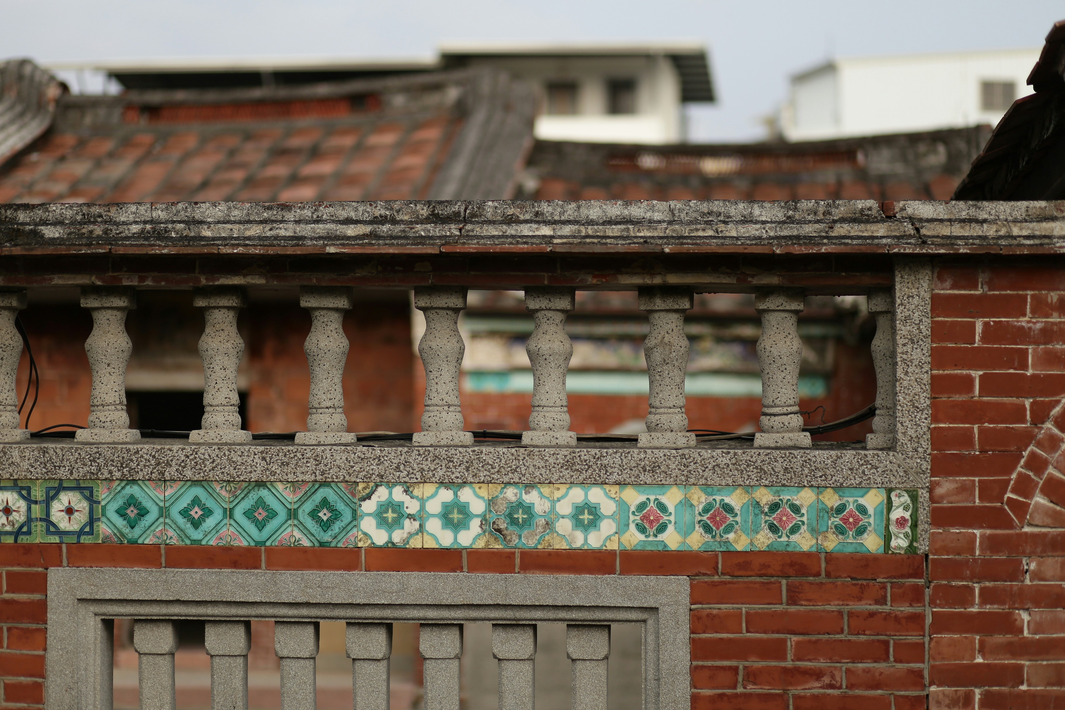 Terracotta Skyline: Balcony Rail and Mosaic Band
