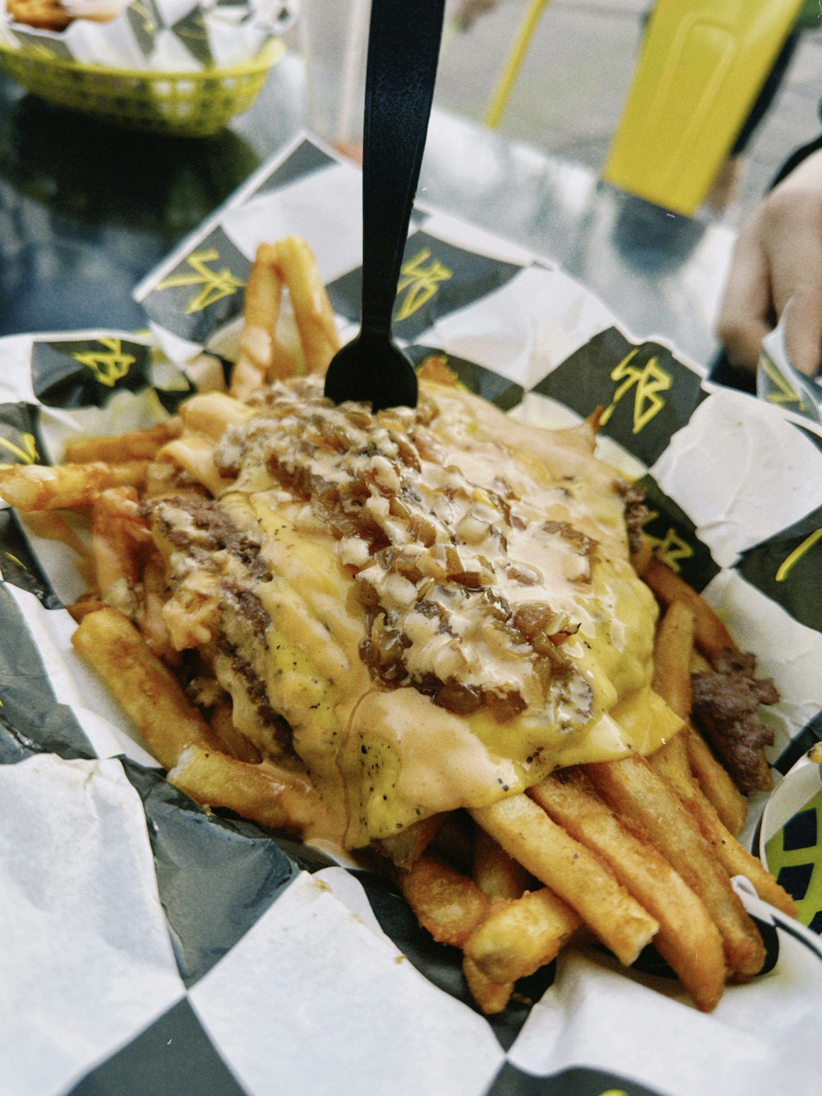 Cheesy Nacho Burger Crowned with Melted Cheese and Crispy Fries