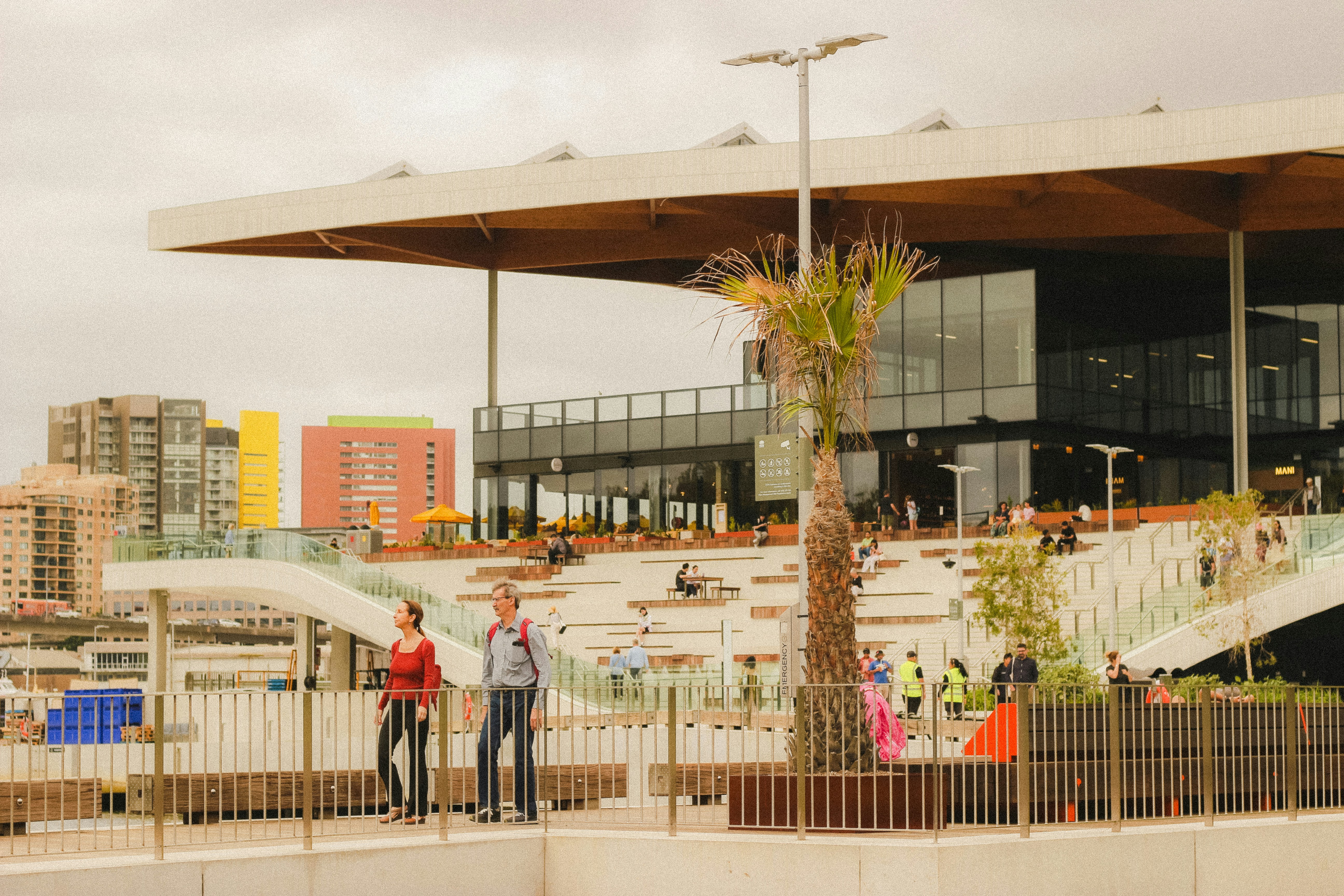 People by a Modern Waterfront Pavilion