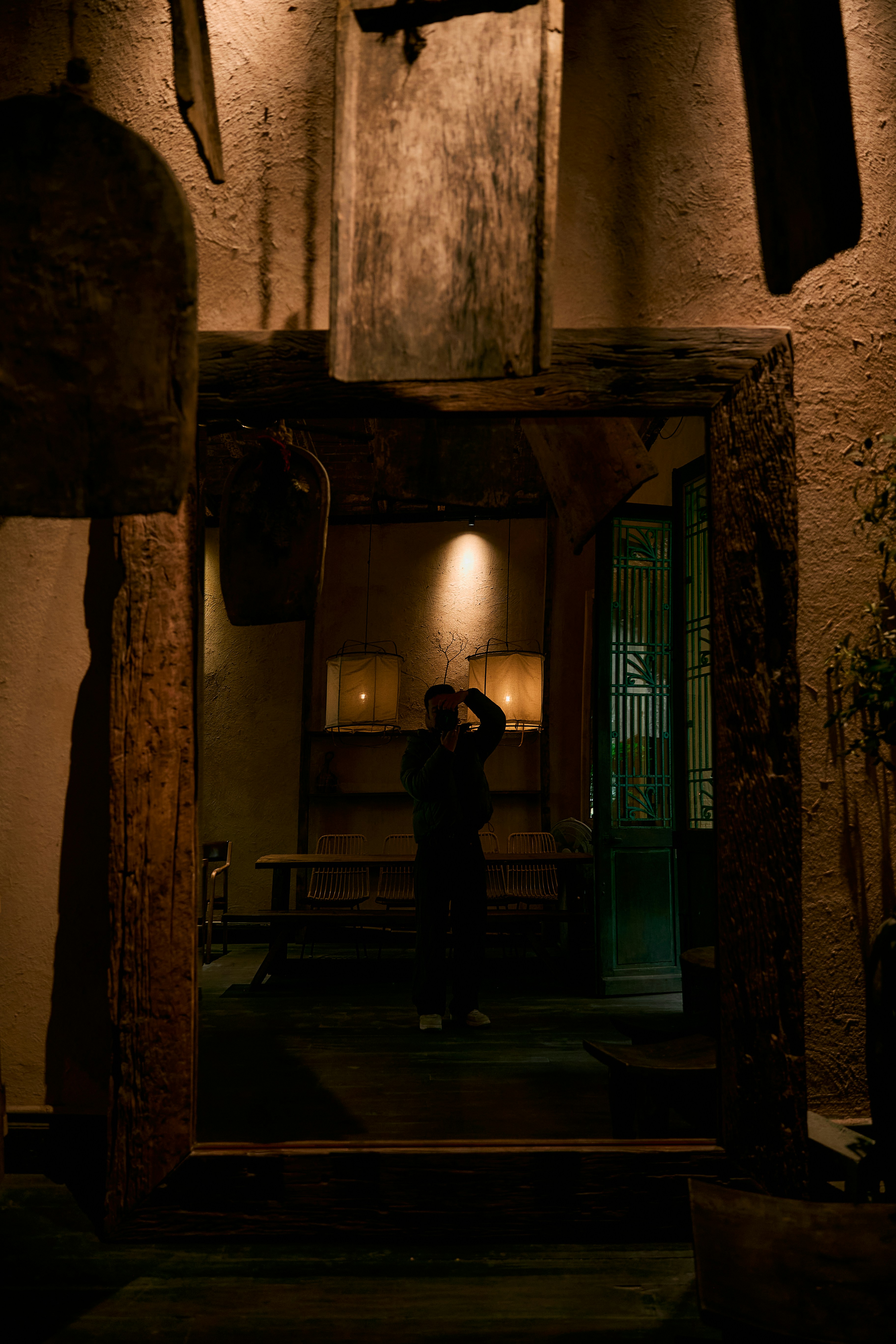 Shadowed Portrait in a Dim Courtyard