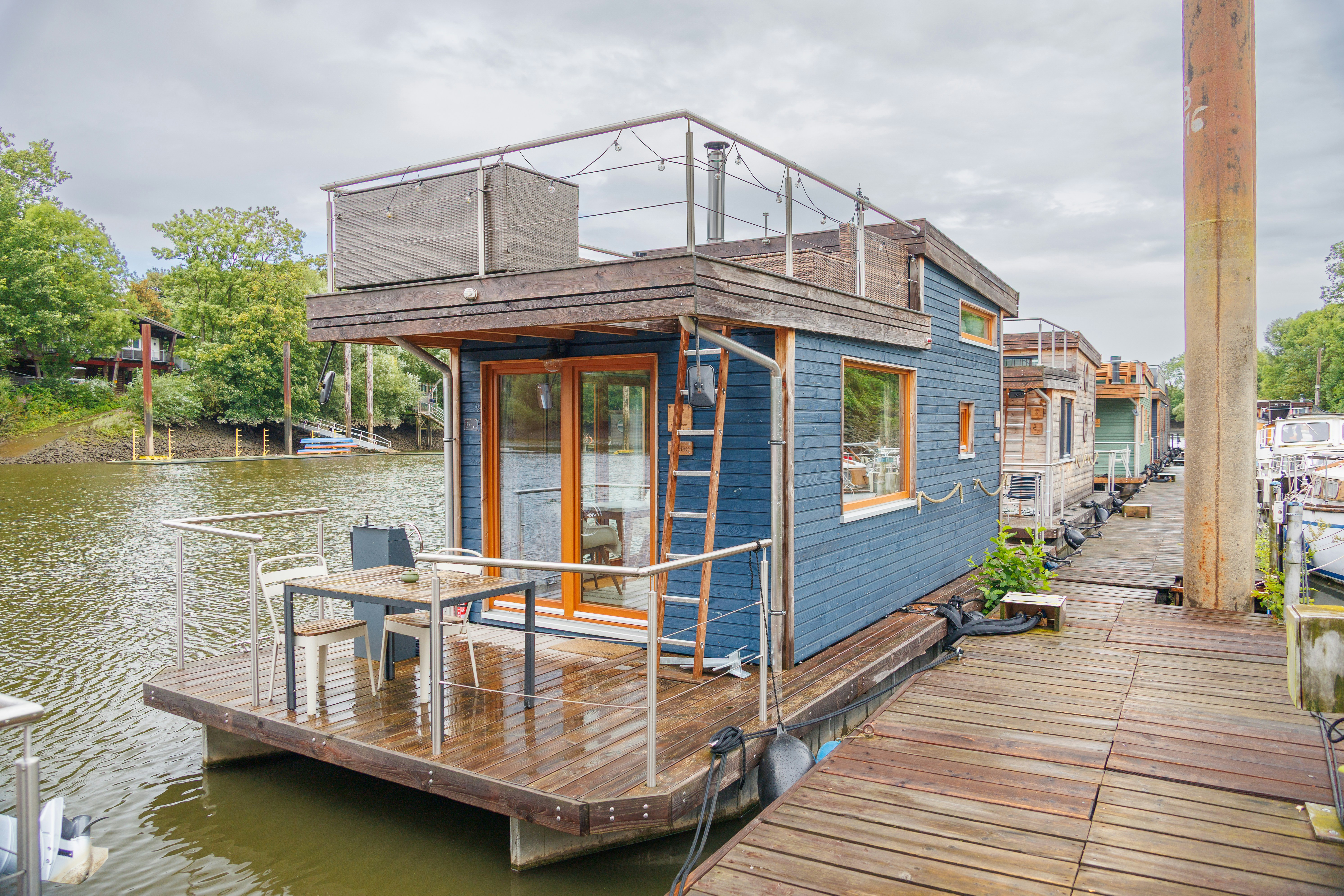 Floating Blue House on a Quiet Waterway