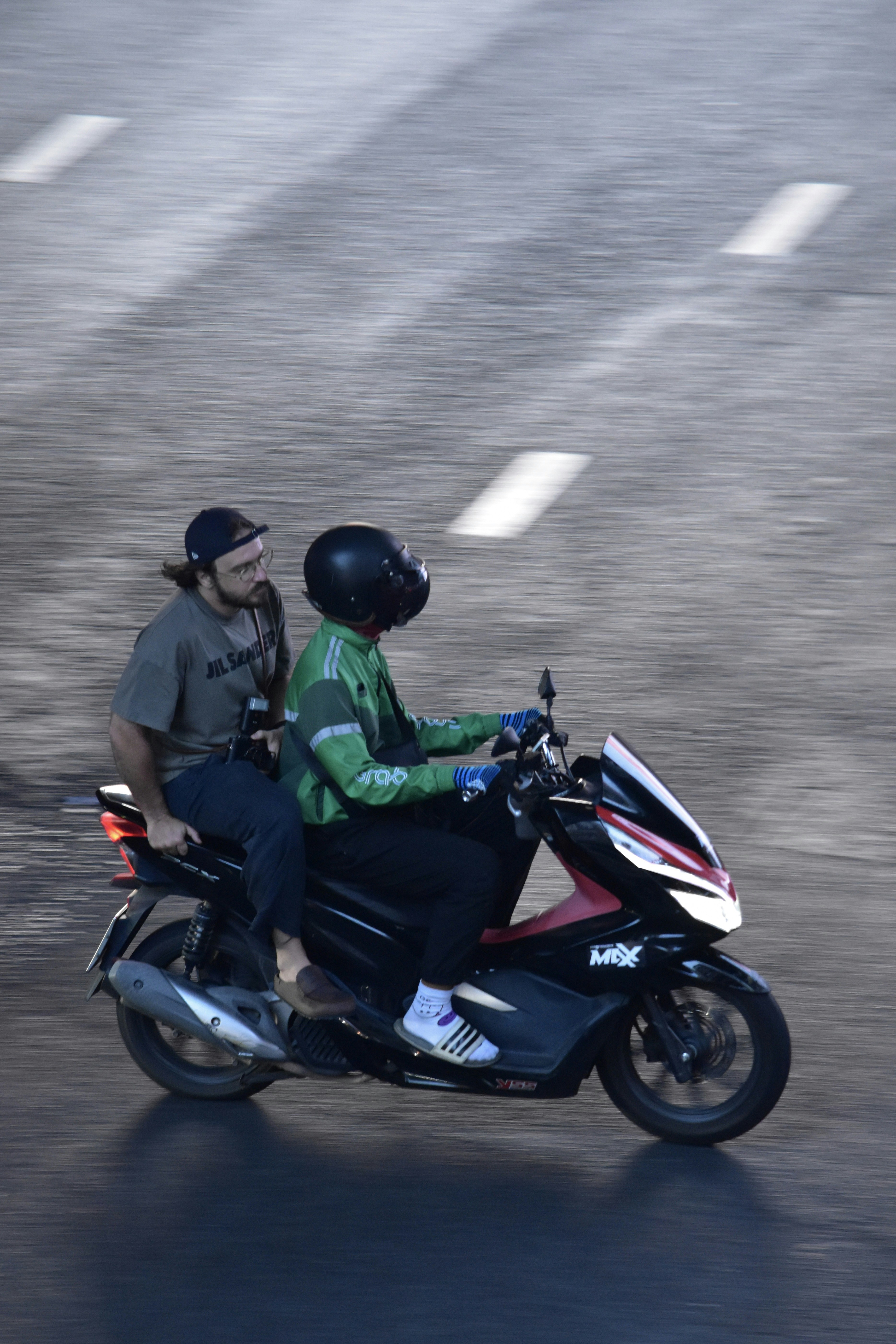 Back-Road Ride: Two Riders In Motion on a City Street