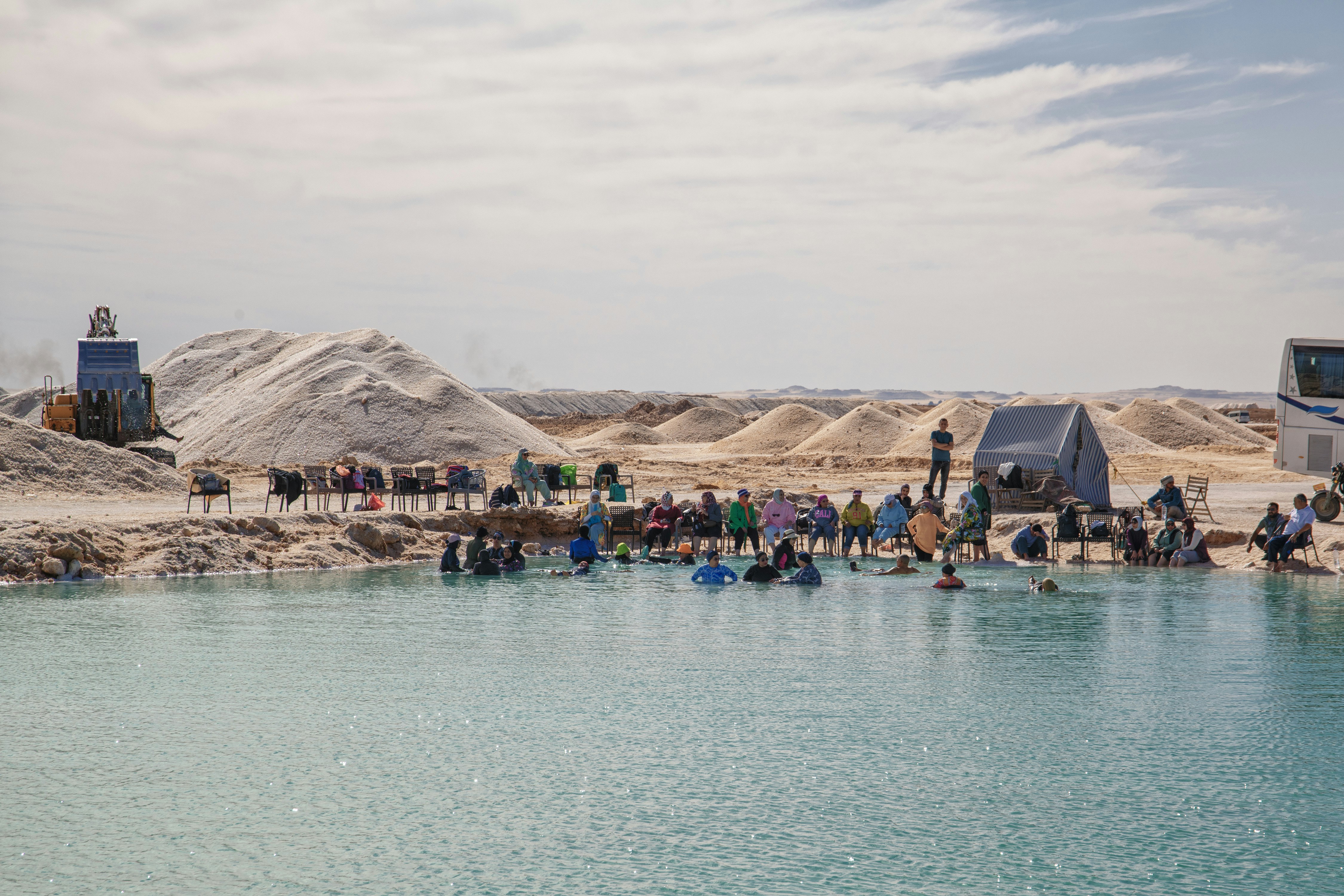 Vibrant Riverside Gathering at a Sandy Oasis