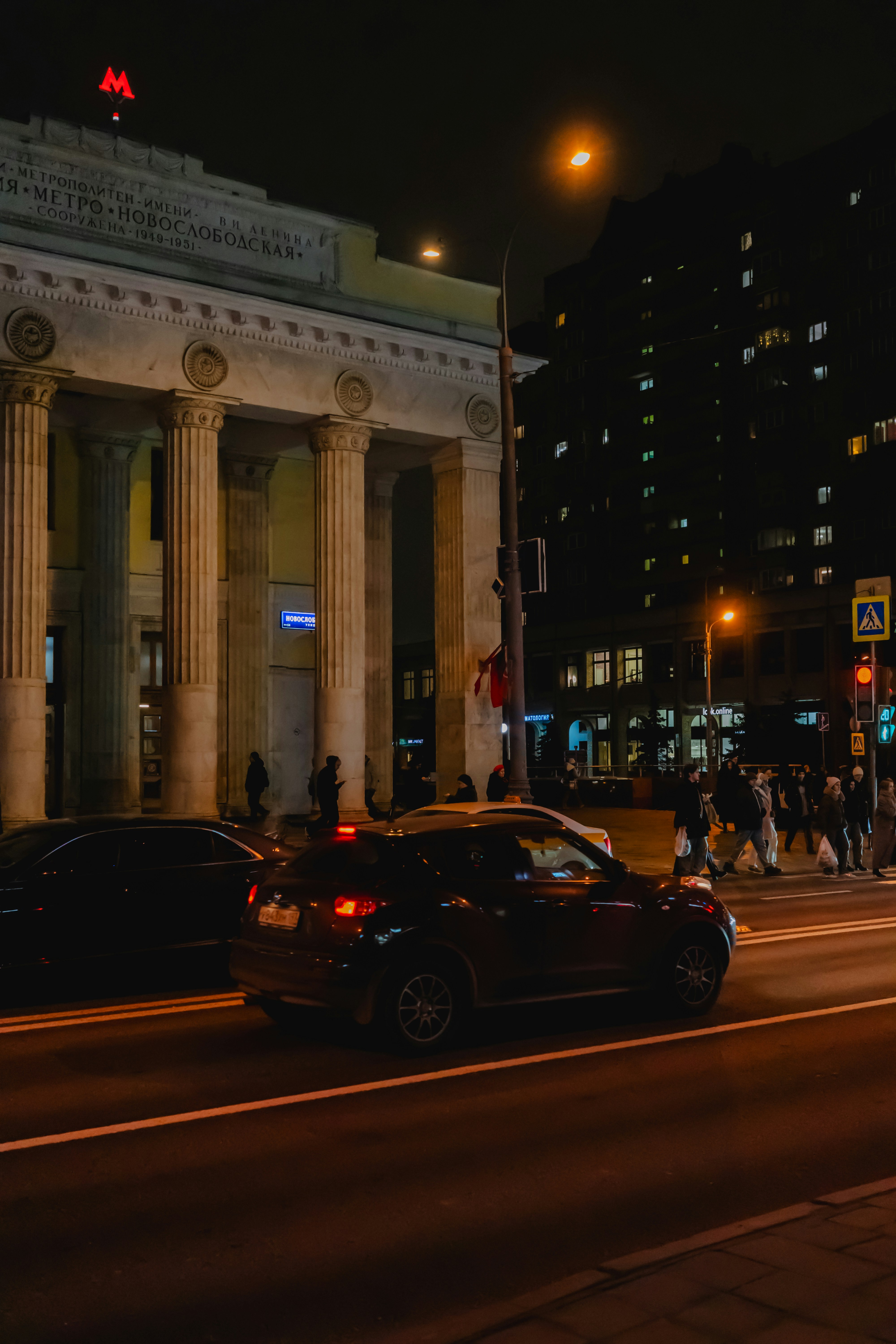 Night Street Pedestrian Crossing Before a Neoclassical Facade