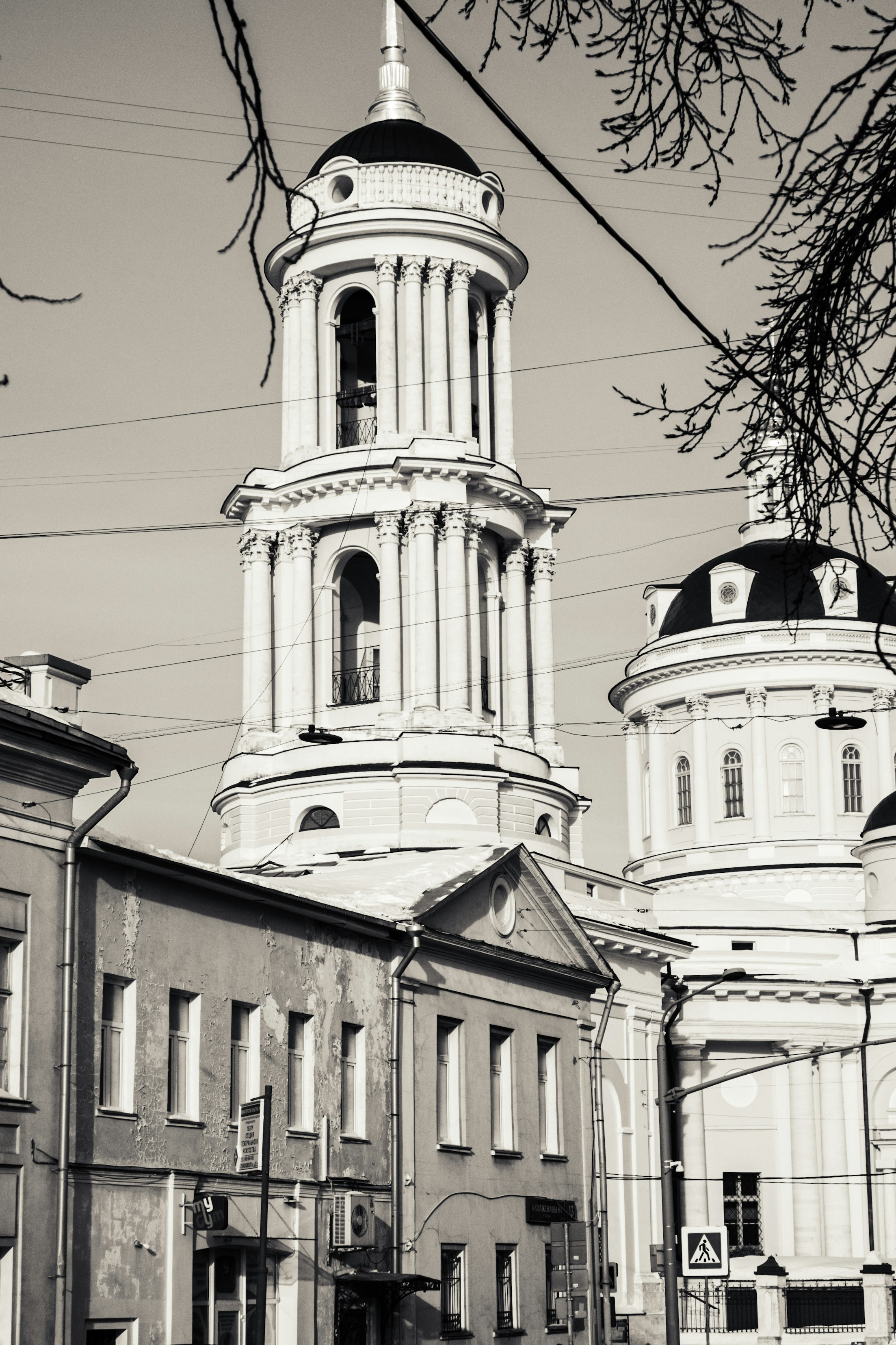 Urban Bell Tower in Sepia: A Quiet Monument Amid Wires