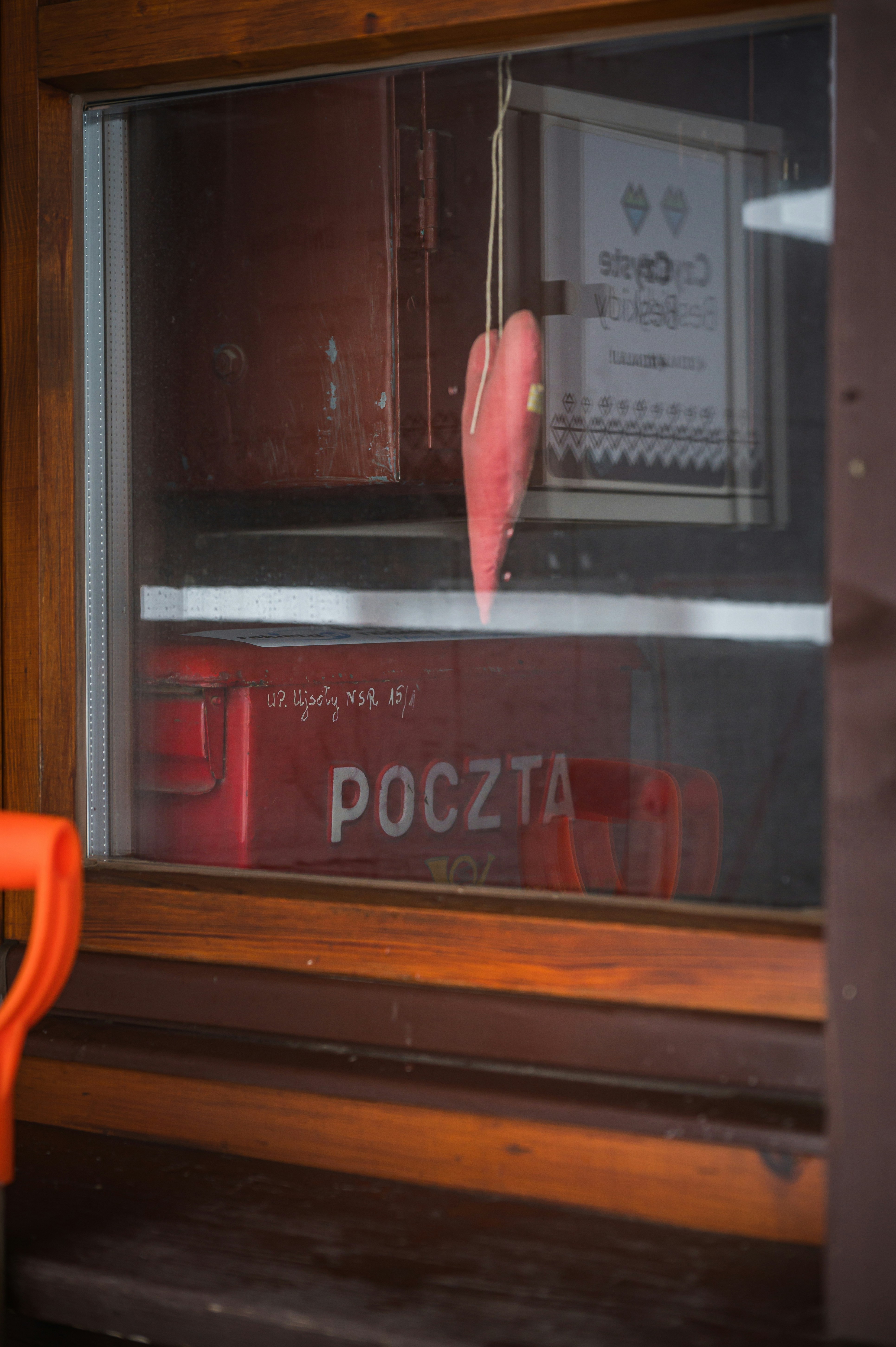 Red Mailbox Reflected: A Quiet Window Scene