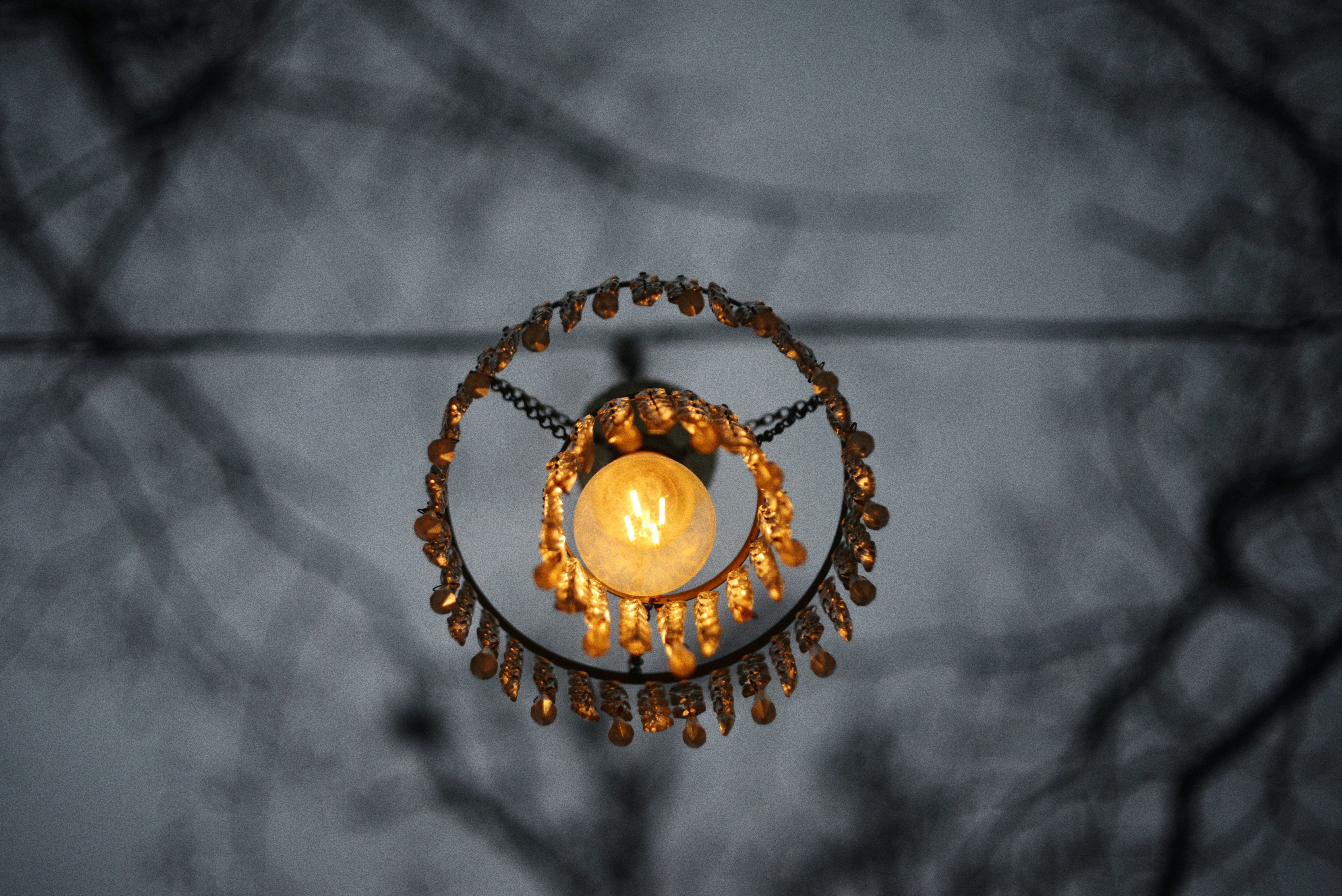 Glowing Ring: A Lantern Orbiting a Crystal Pendant