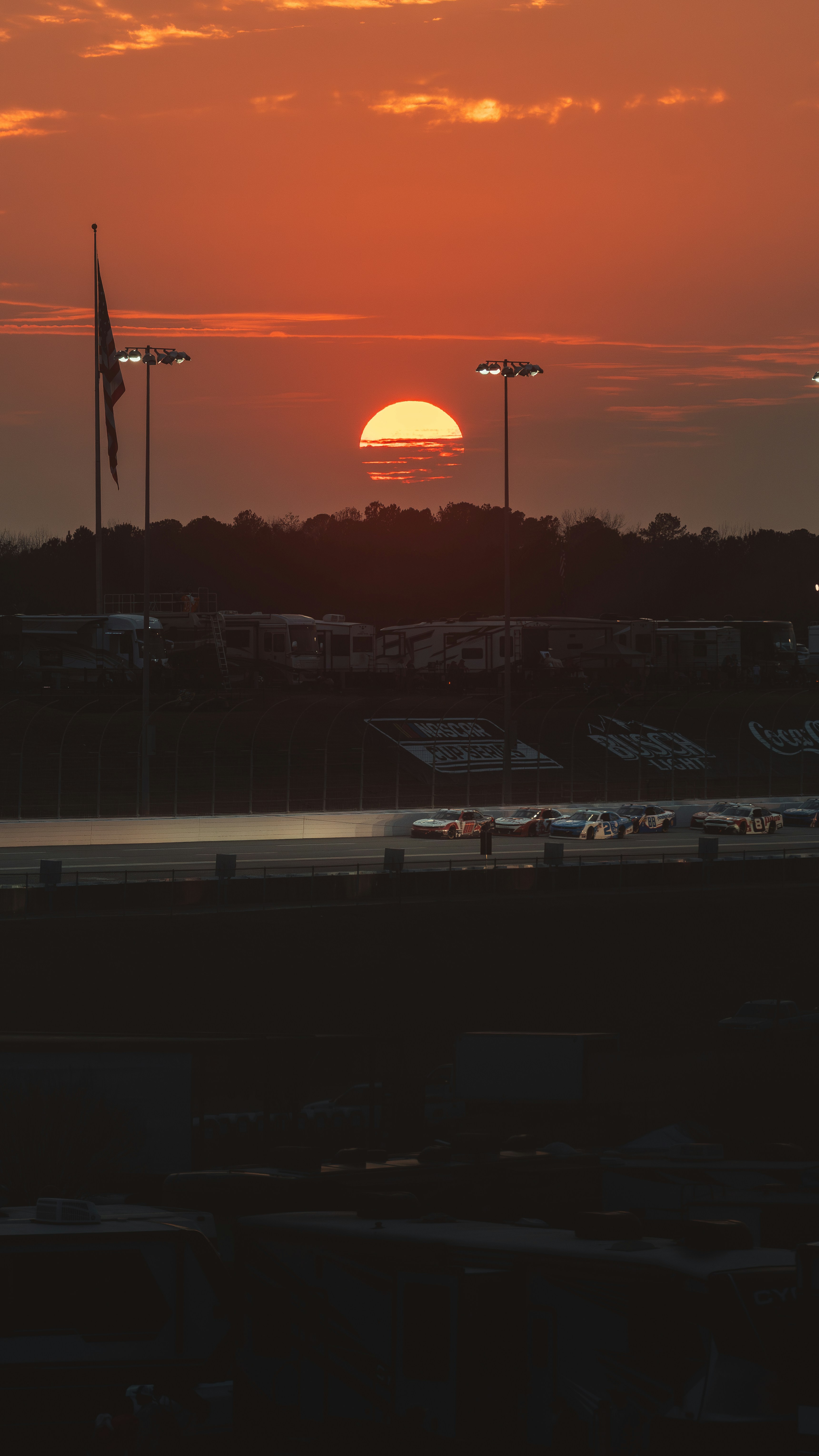Setting Sun Over the Raceway: Quiet Drama Beyond the Paddocks
