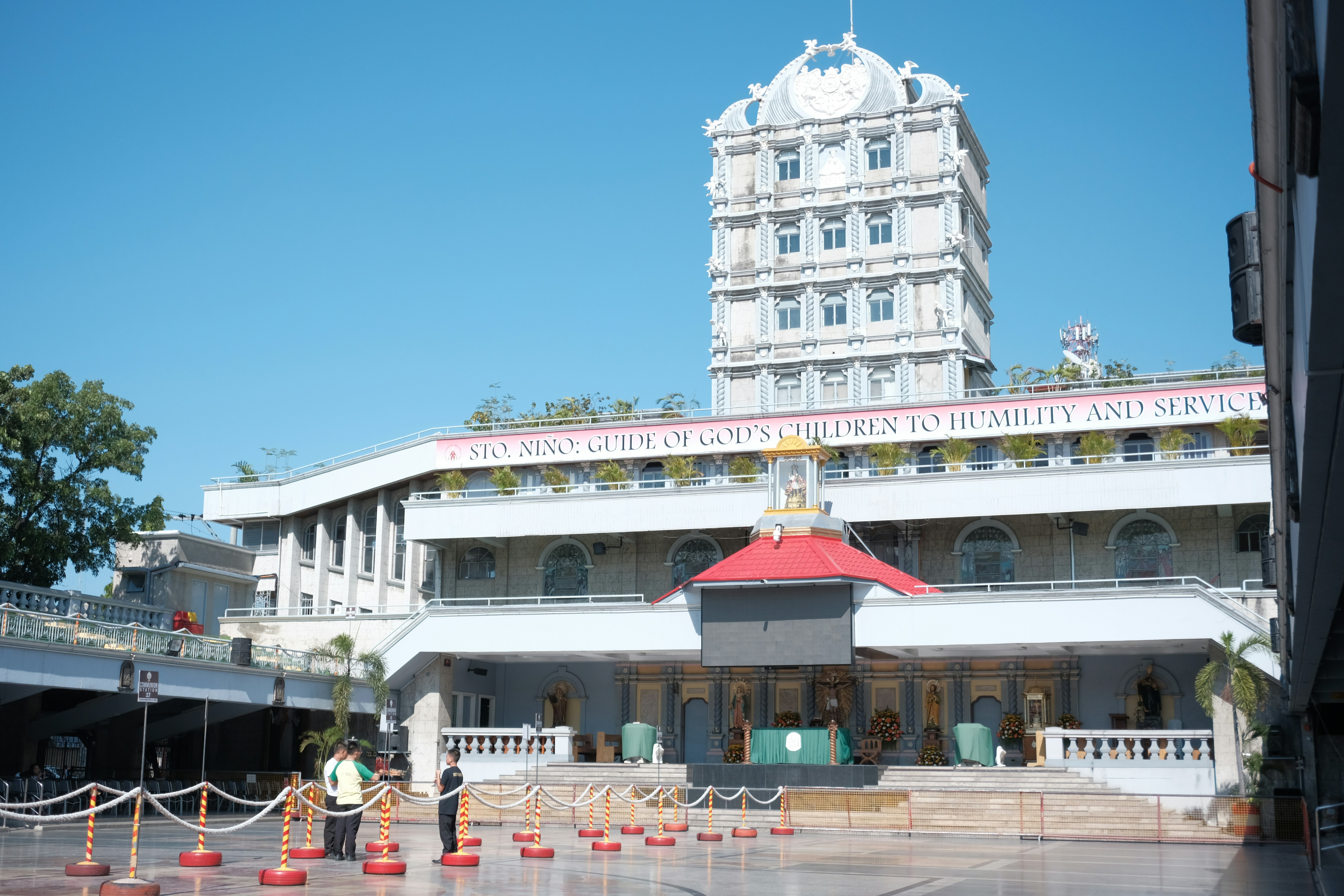 Temple Facade Under Clear Sky: A Quiet Courtyard Scene