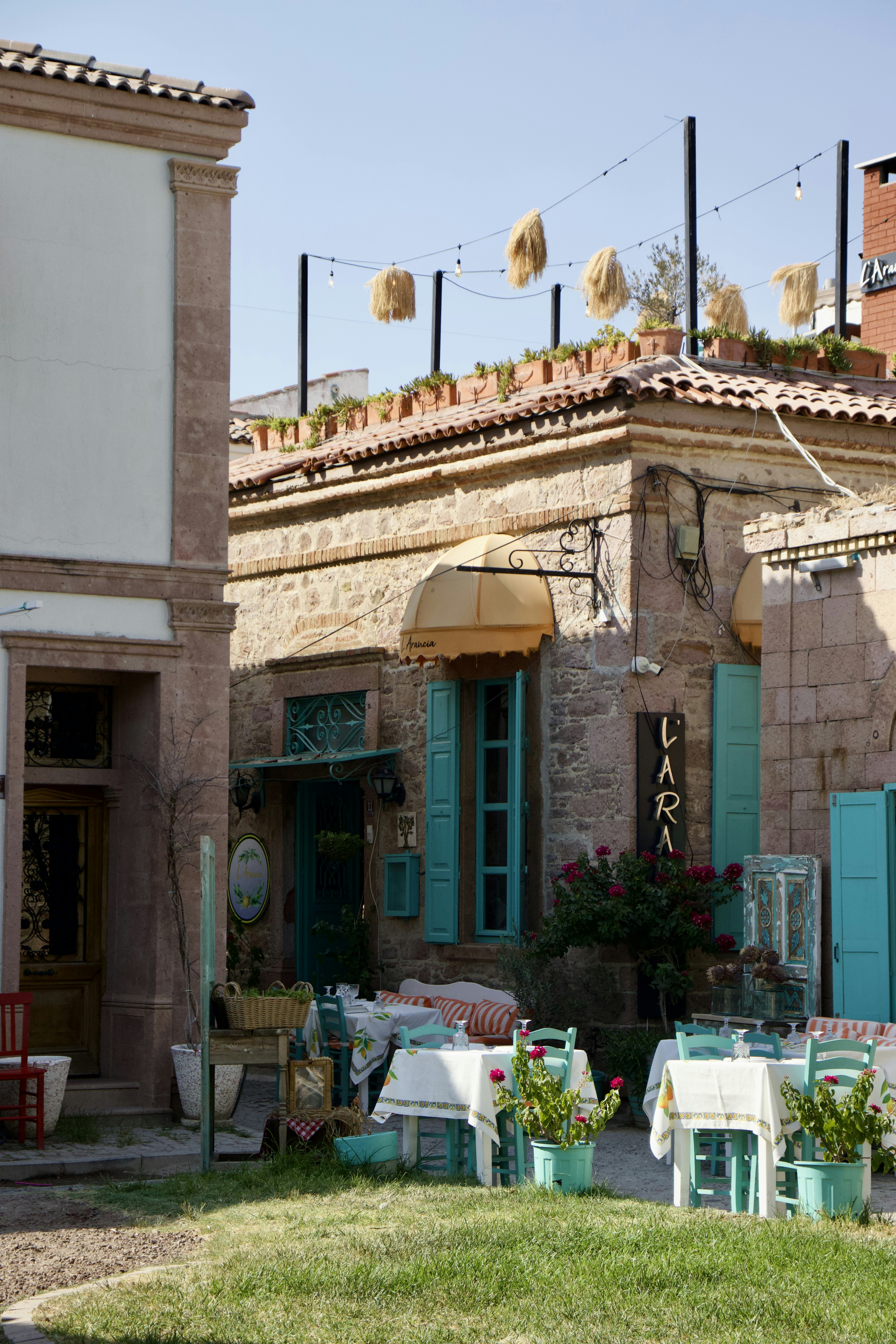 Cobbled Café Courtyard in Sunlit Village