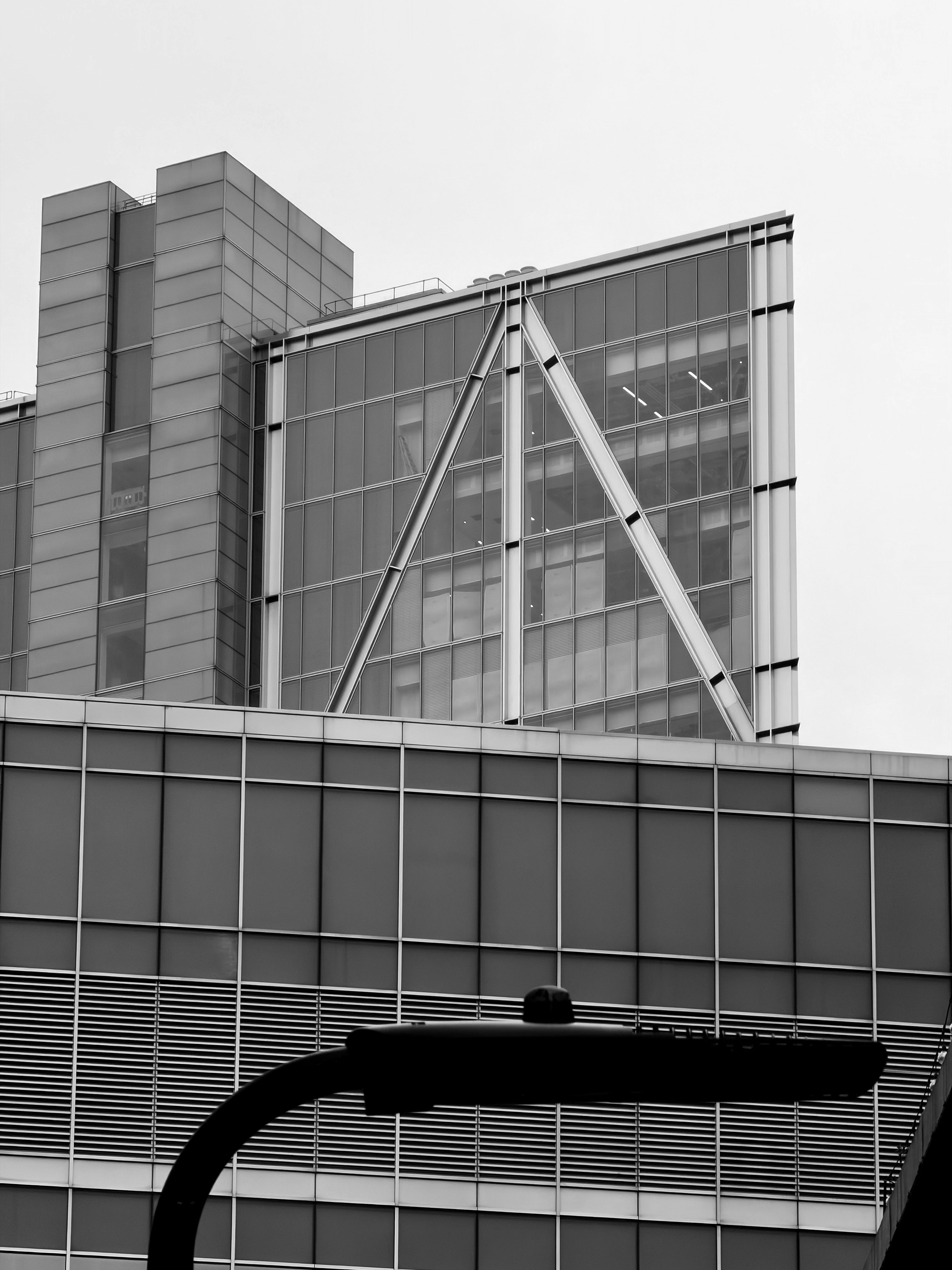 Geometric Facade: Concrete Angles and Glass Grids