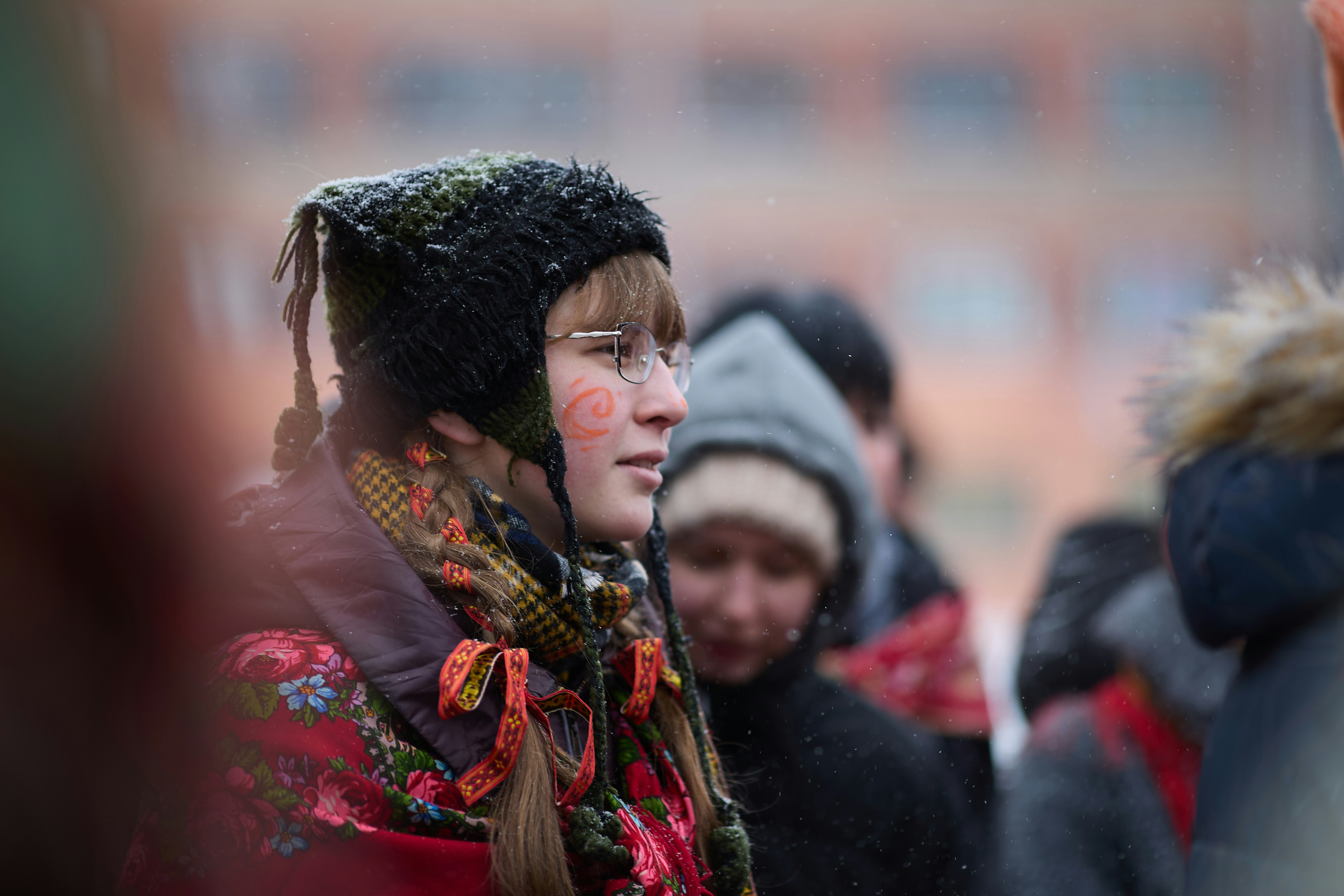 Warm Gaze Amid Snowfall: A Portrait in Color and Craft