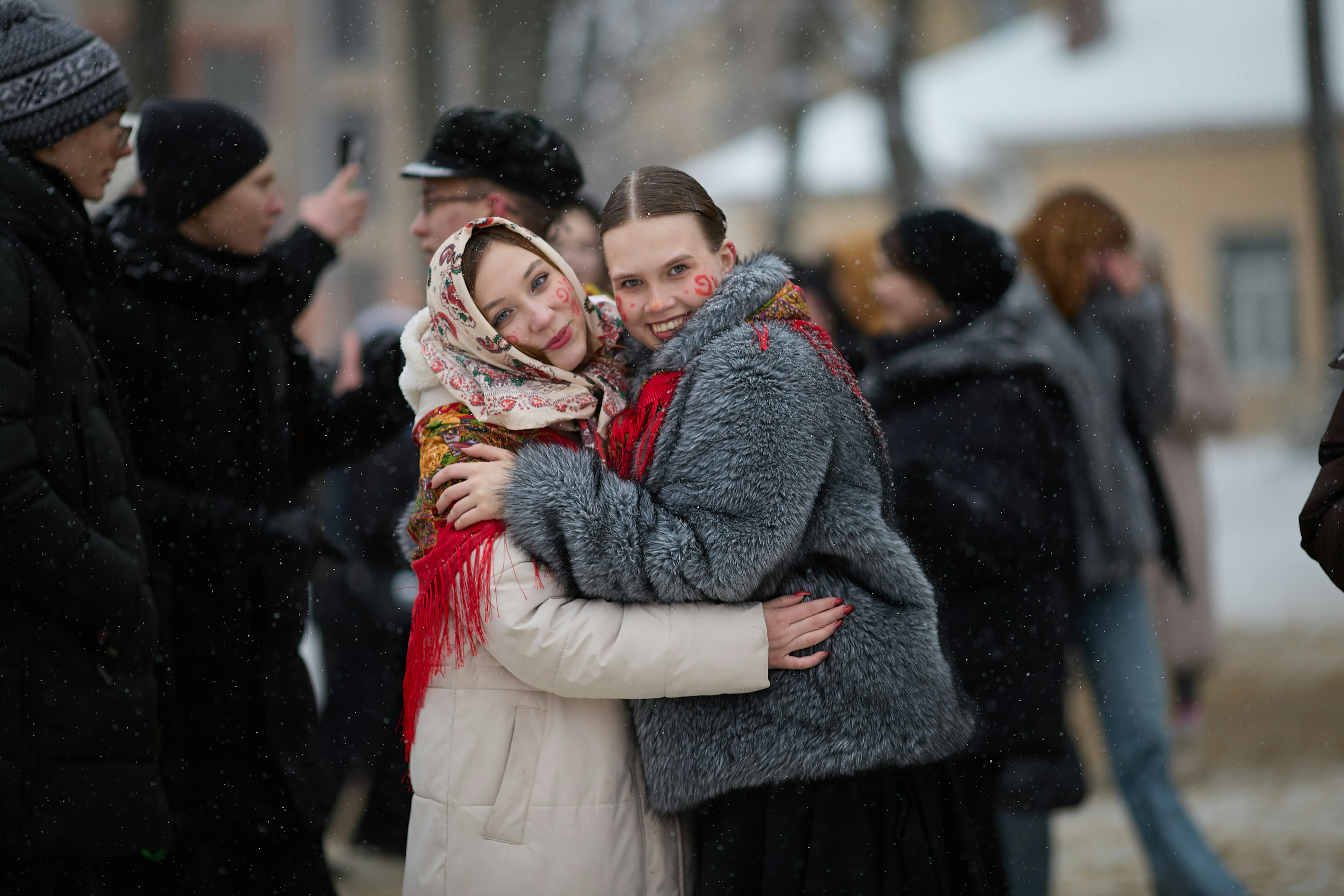 Two Warm Embraces in a Cold Winter Scene