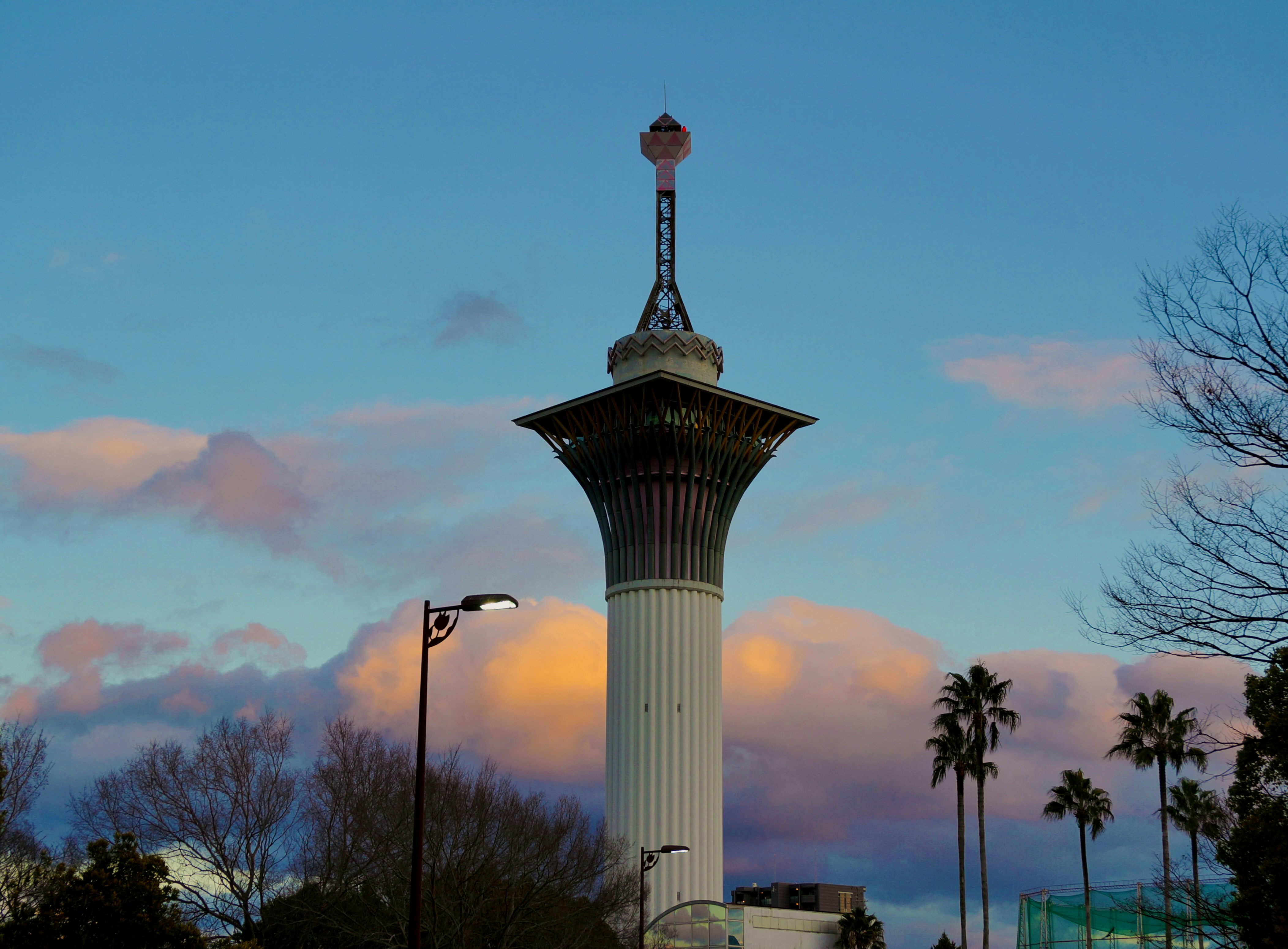 Skyward Tower Under a Sunset Sky