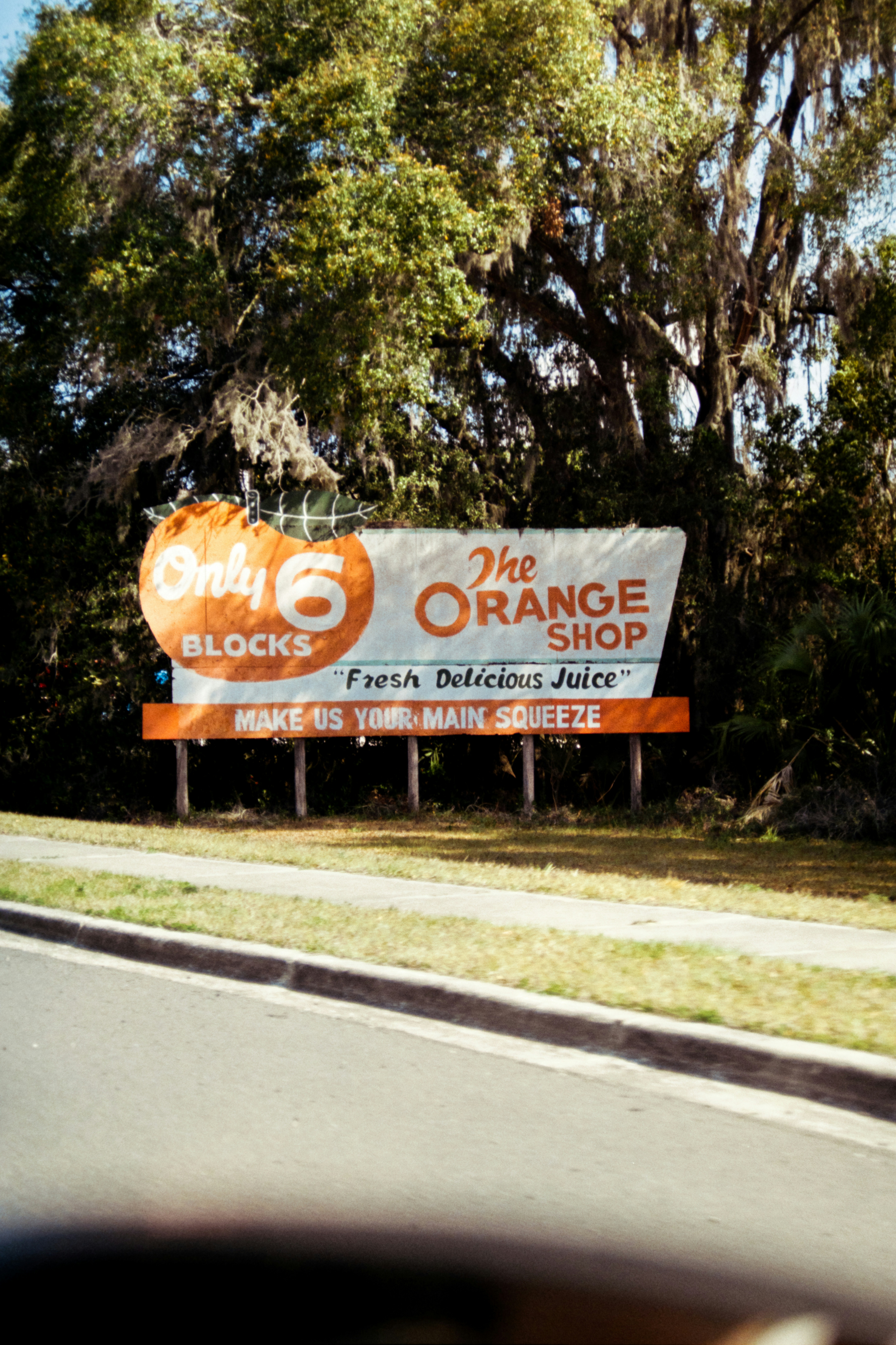 Orange Shop Billboard on the Curved Road