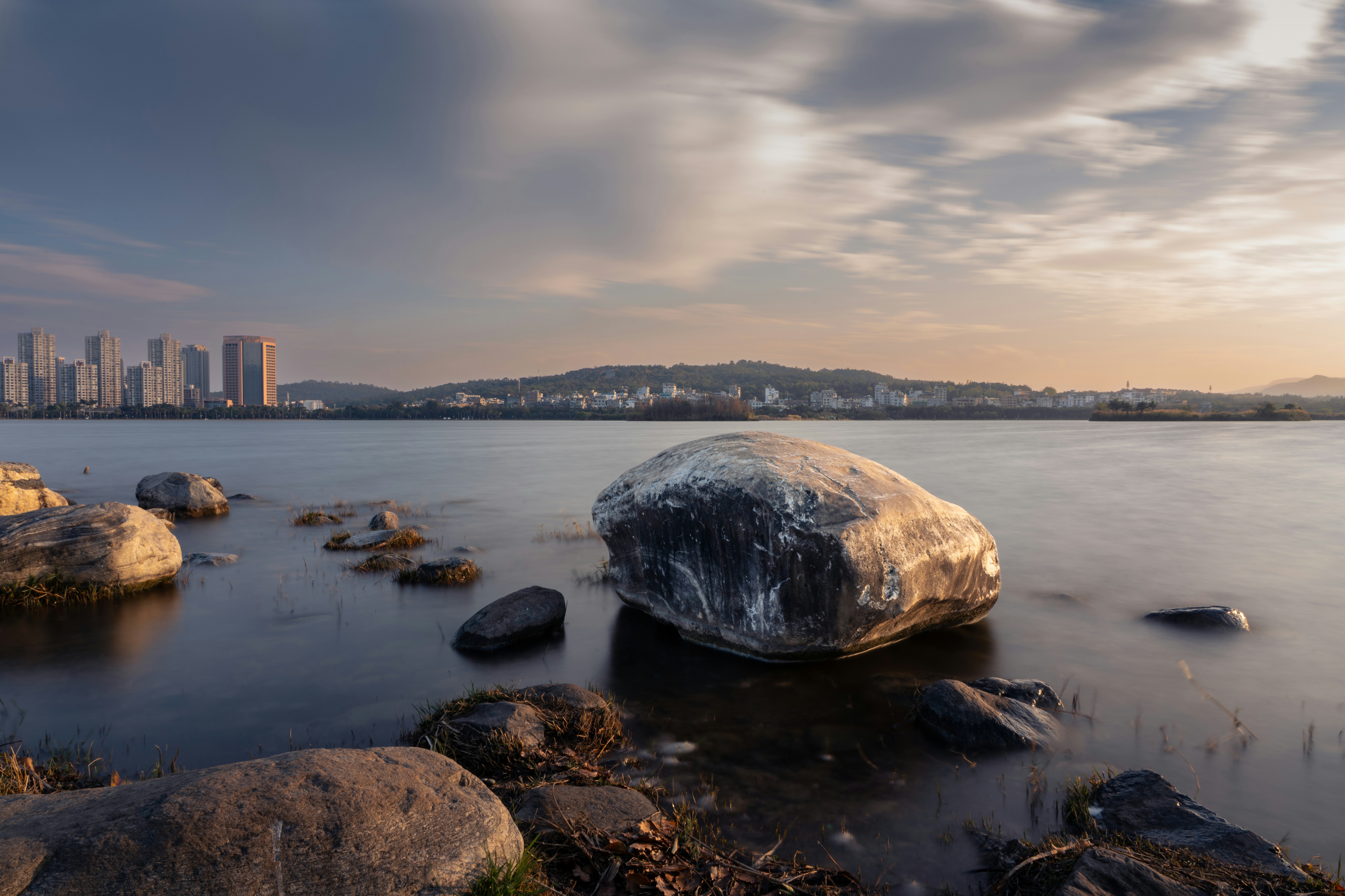 Quiet Giants: A Highland Rock Anchors a Calm Coastal Dawn