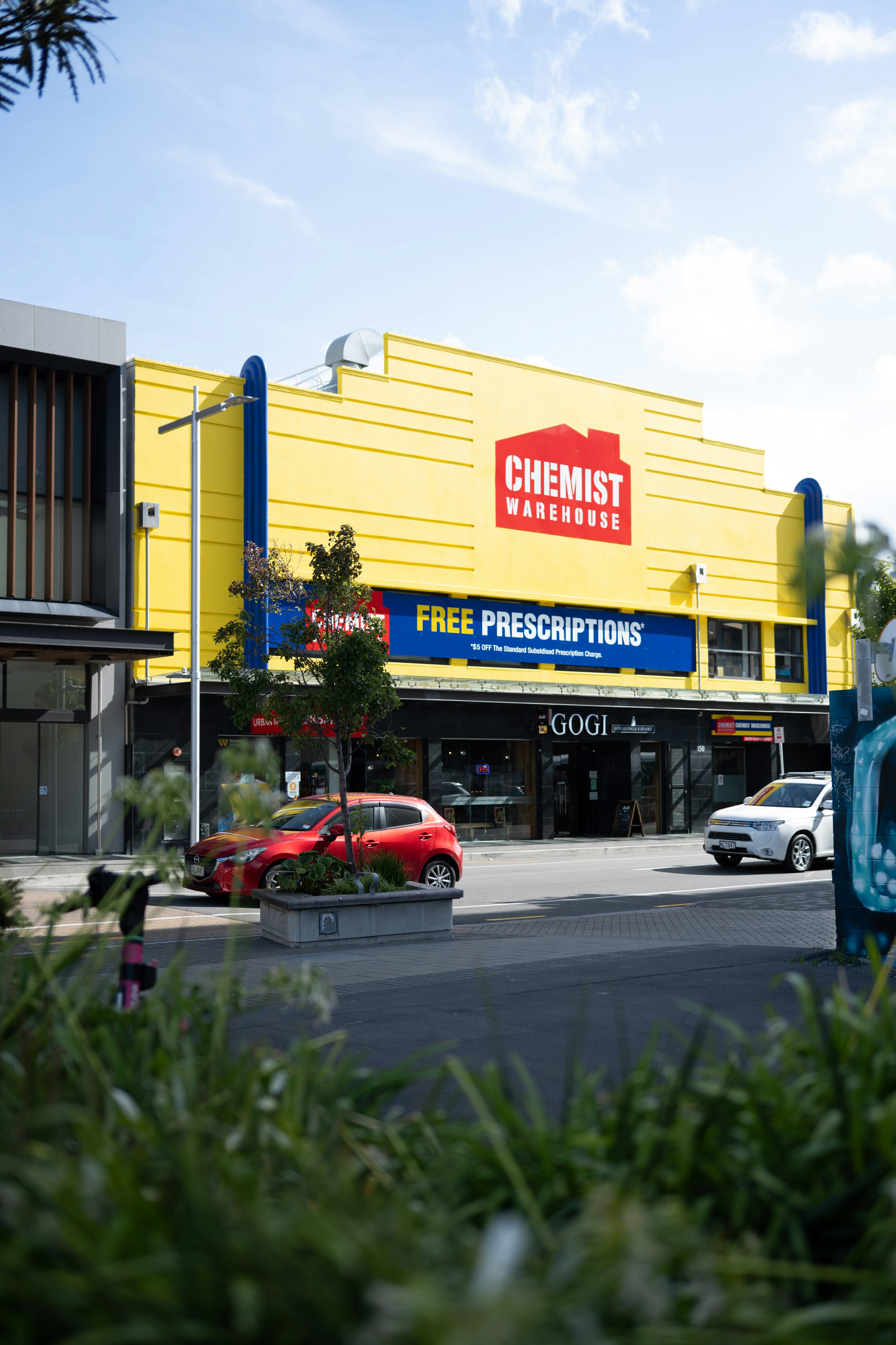 Yellow Warehouse Crowned by a Chemiist Sign