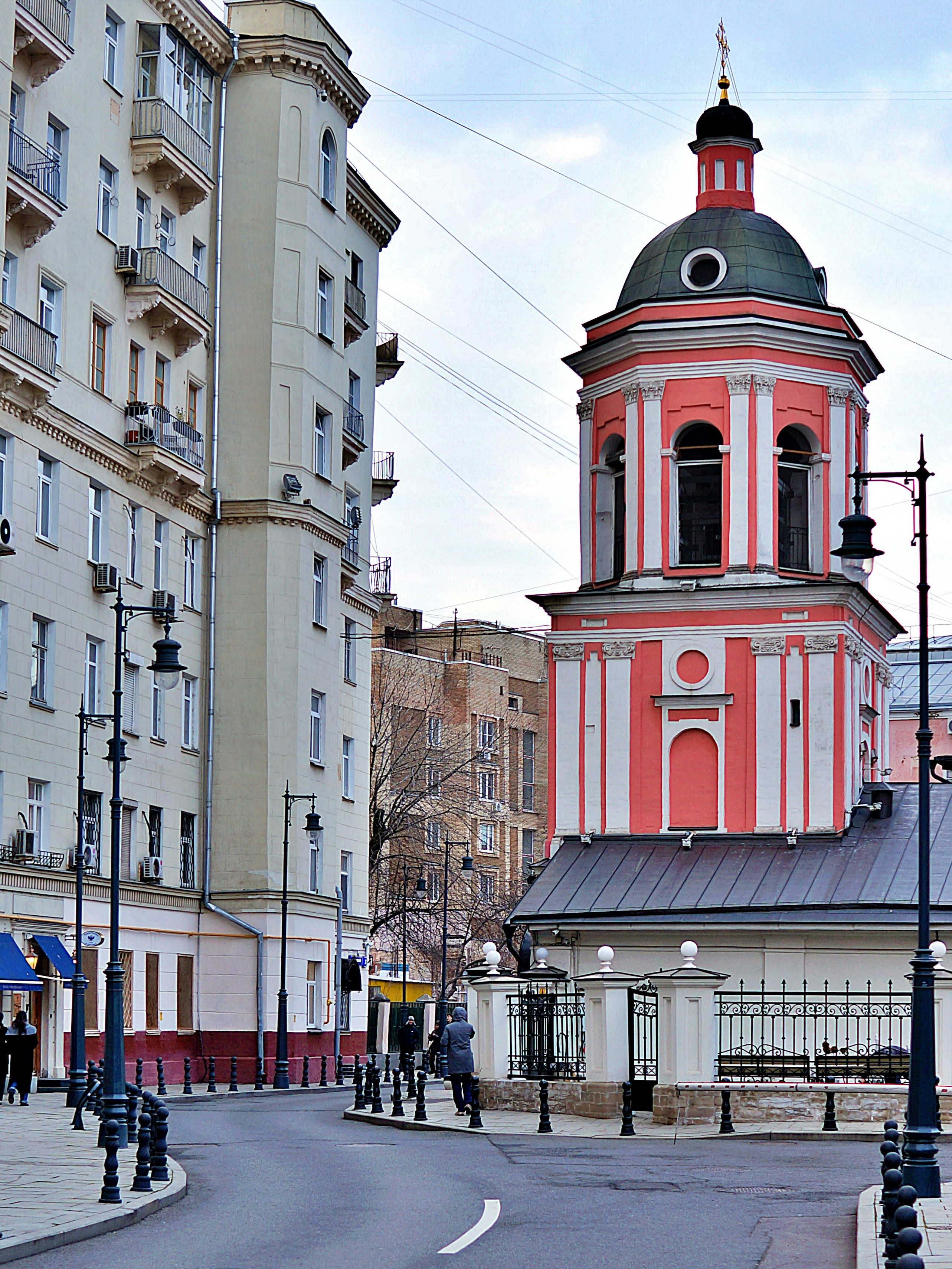 Rose-Accent Bell Tower Overlooks a Quiet Street
