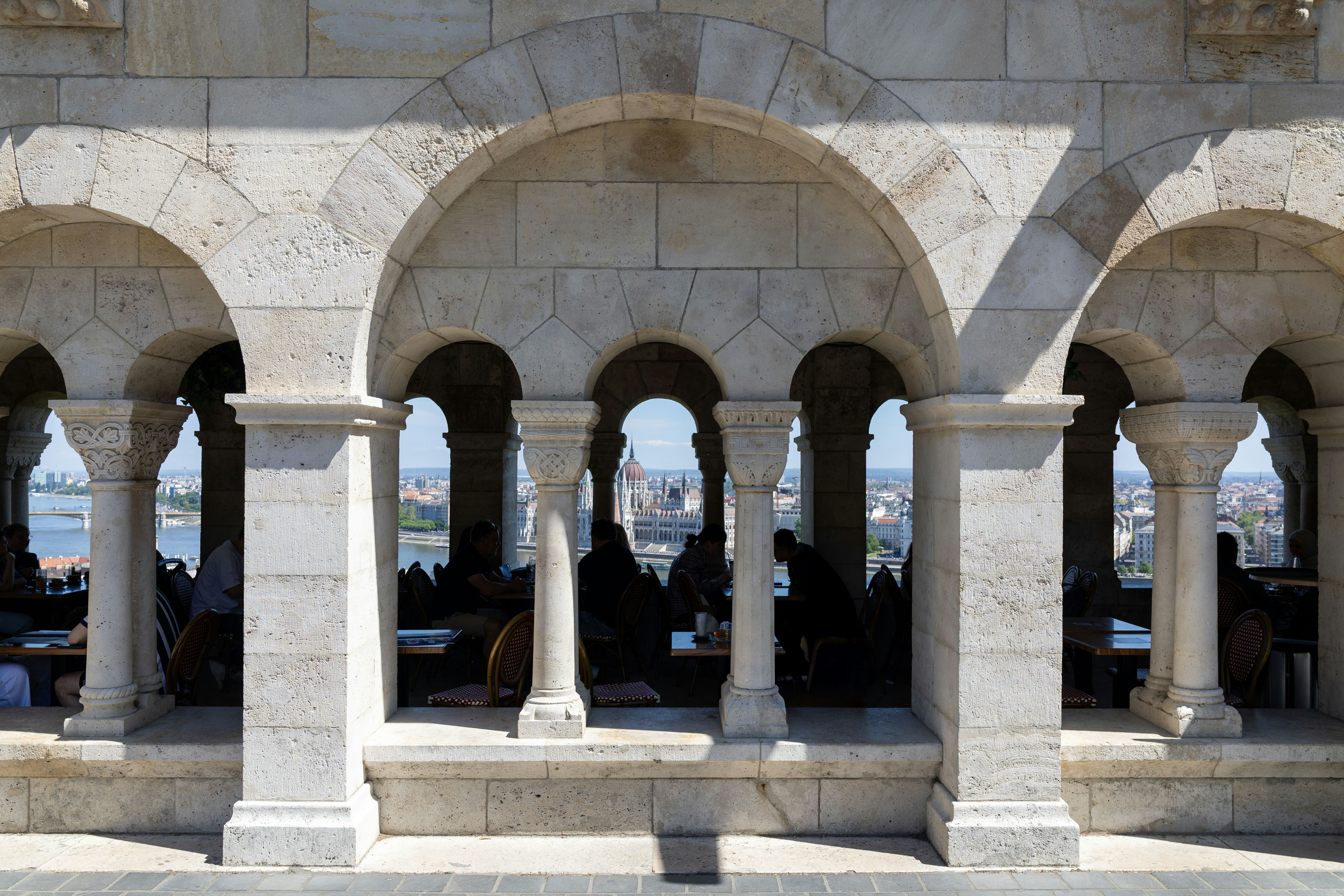 Stone Archway Gallery Framing a Distant City Vista