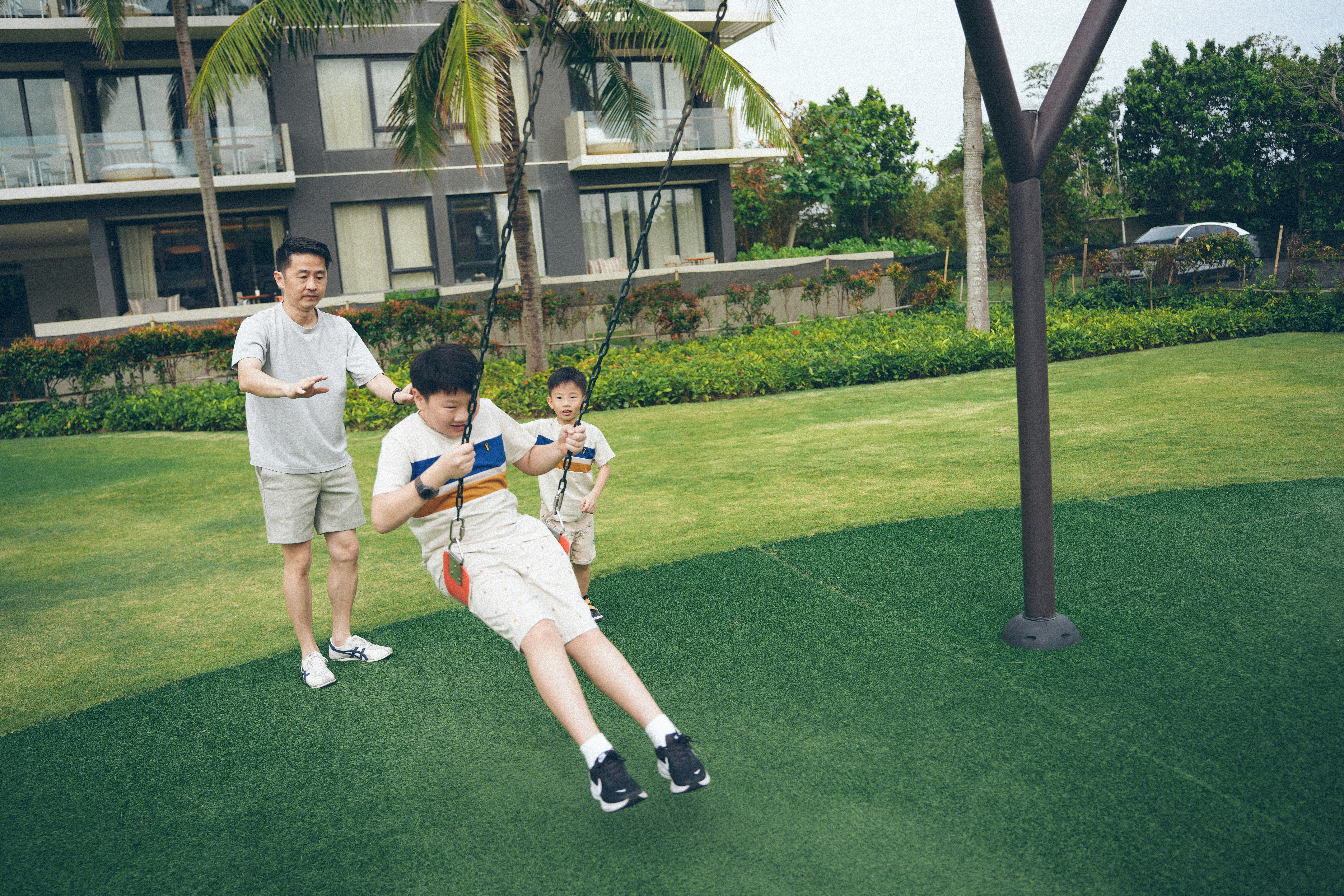 Swinging Ties and Laughter: A Moment of Parkside Play