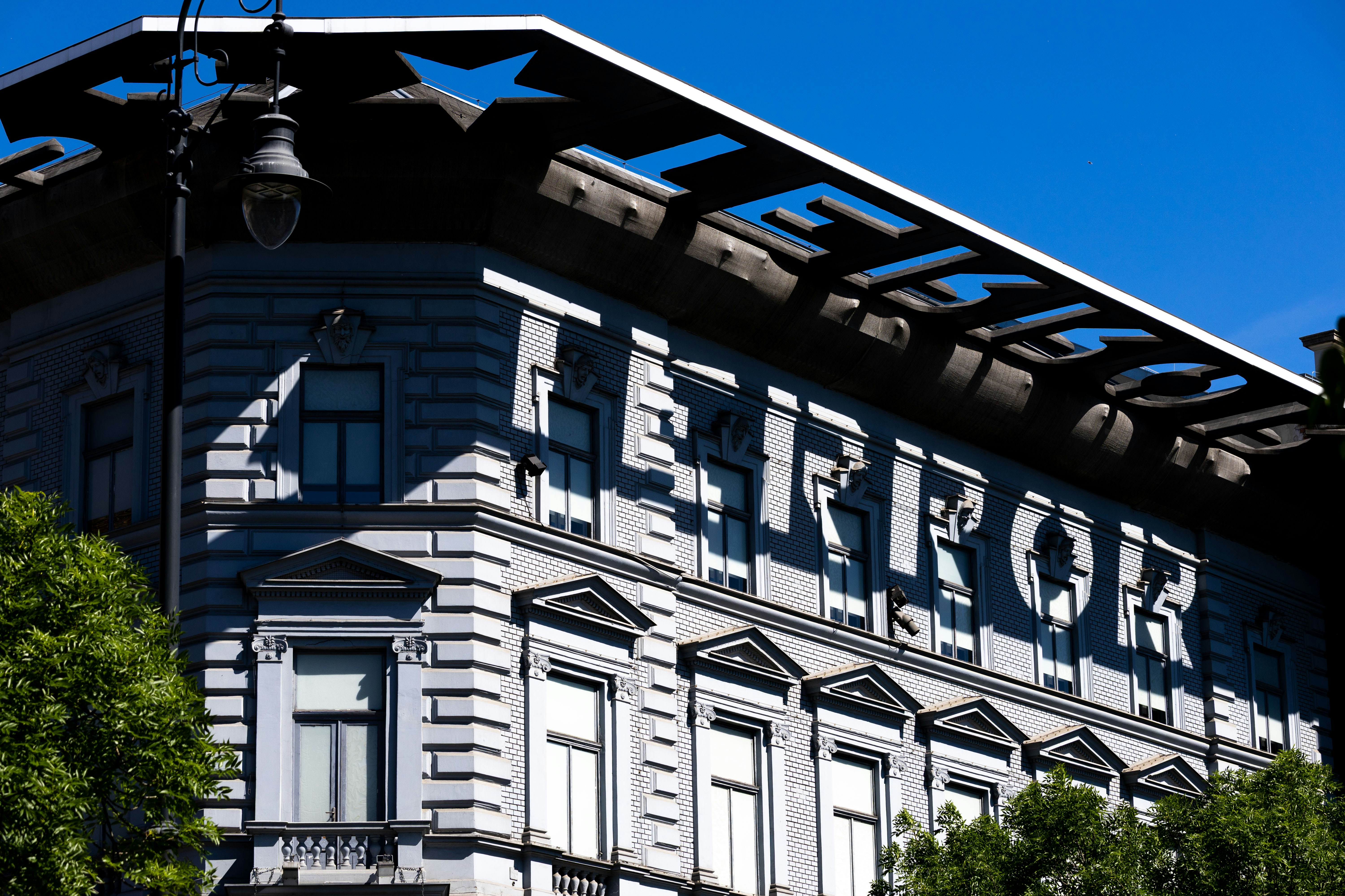 Echoes of Iron: The Leofo Building’s Shadowed Signage