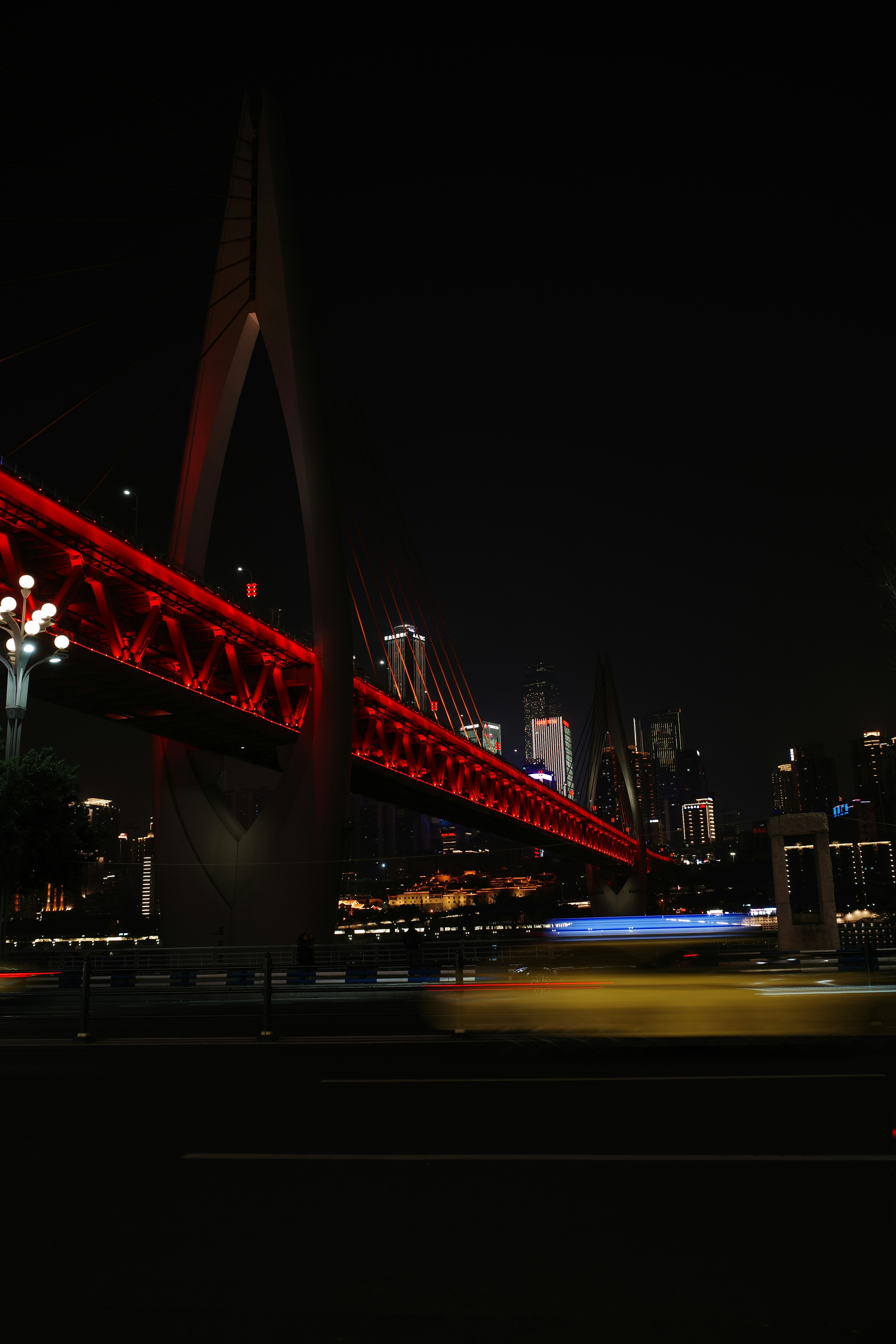 Red Archway at Night: A Neon Bridge over a Silent City