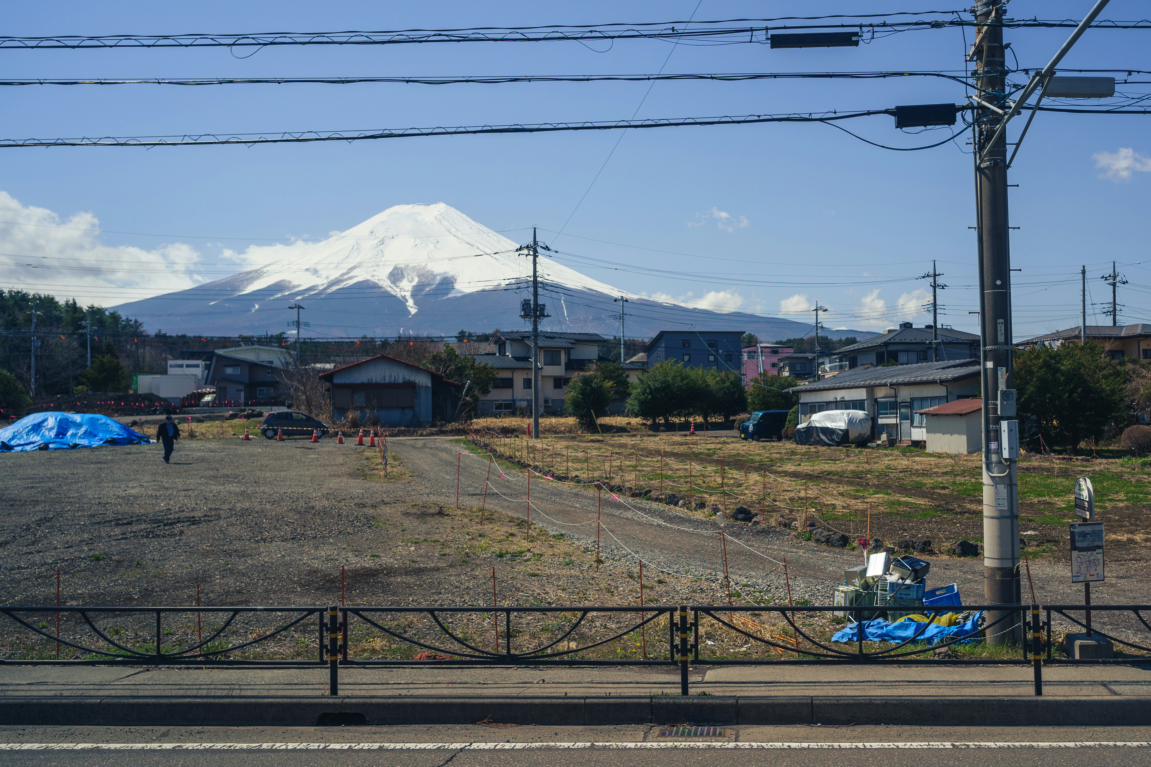 Snow-Capped Peak Framed by Urban Foreground