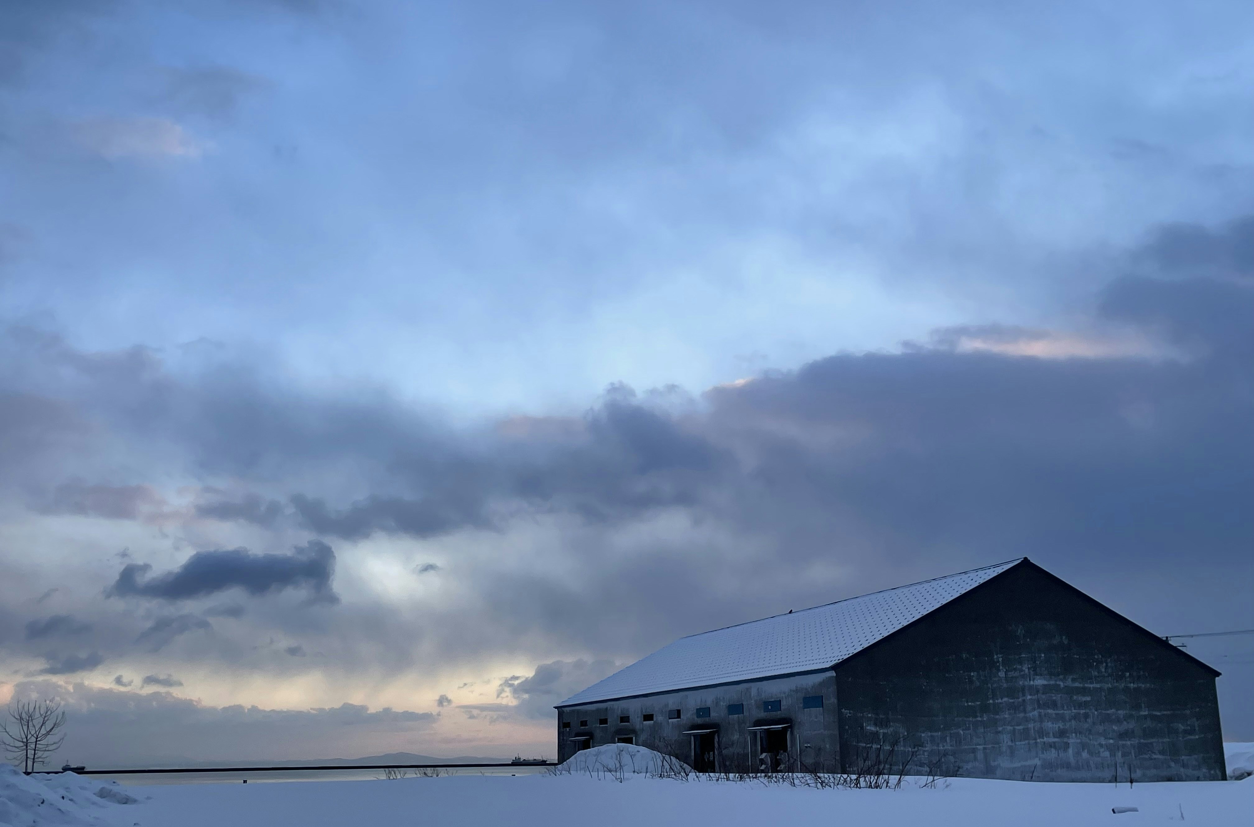Snowbound Barn Under Wide Winter Sky