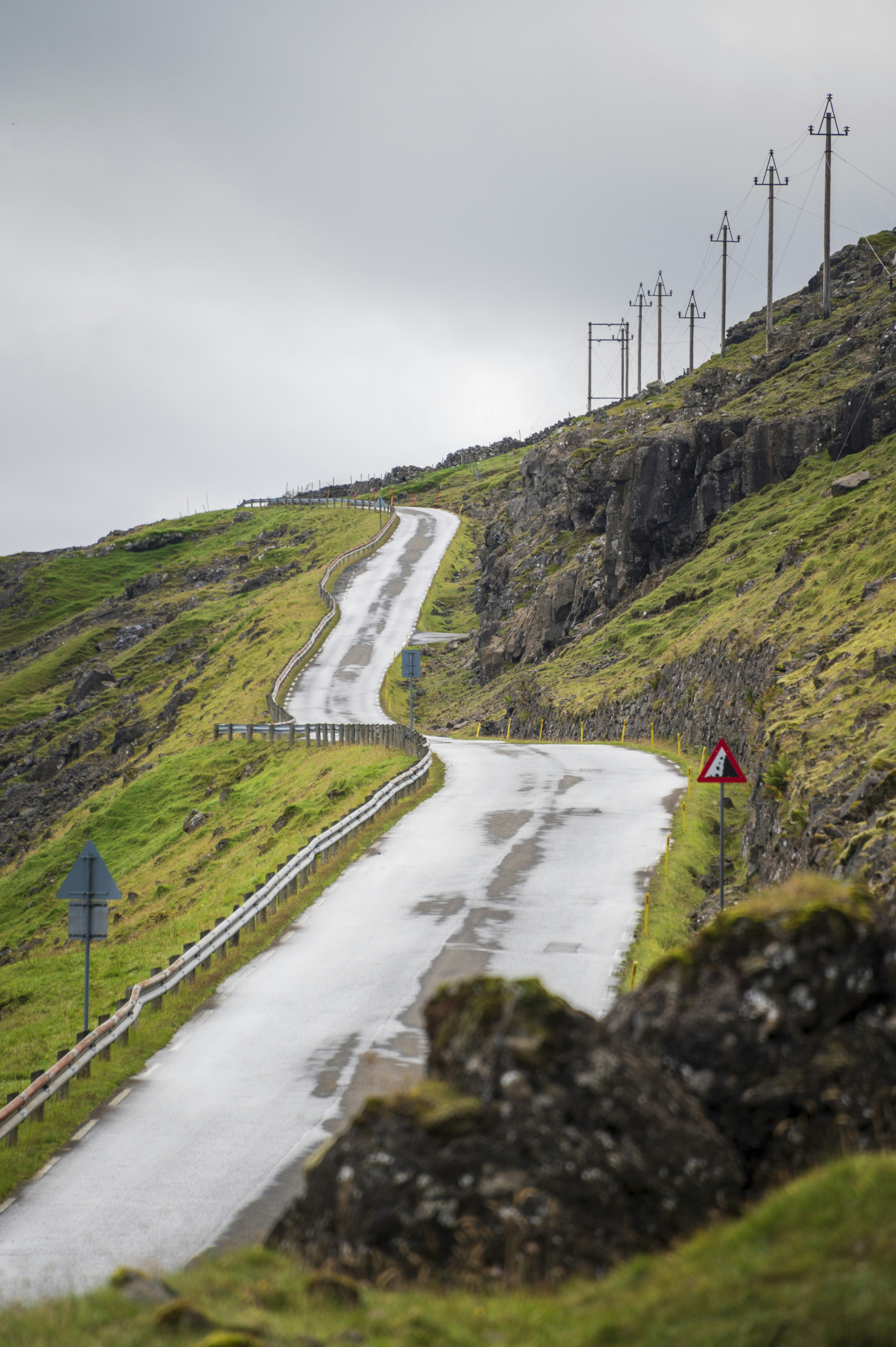 Winding Road Up the Cliff: A Quiet Ascent Through Mist and Green