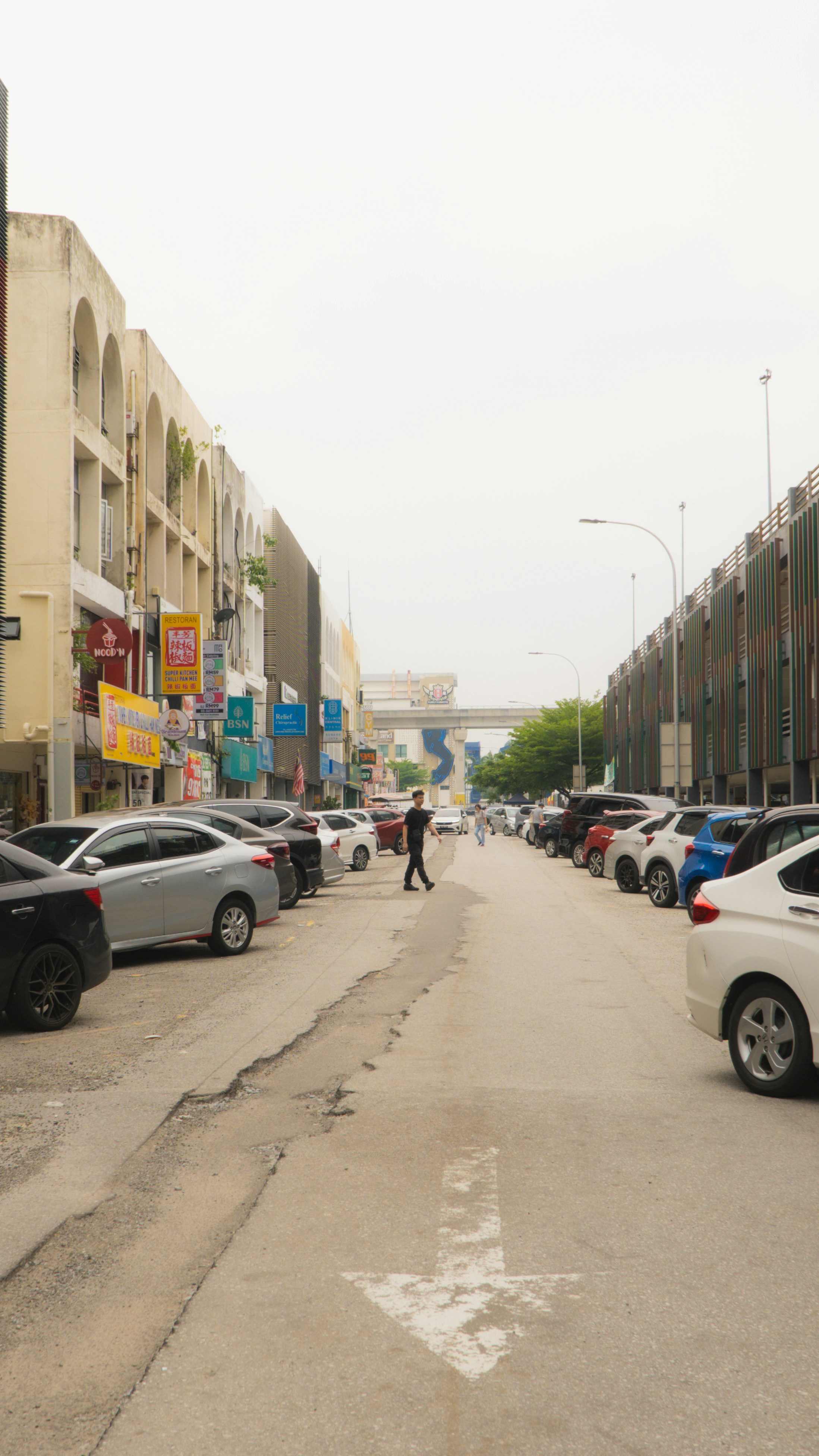 Urban Quiet: Pedestrian Crossing the Busy City Street