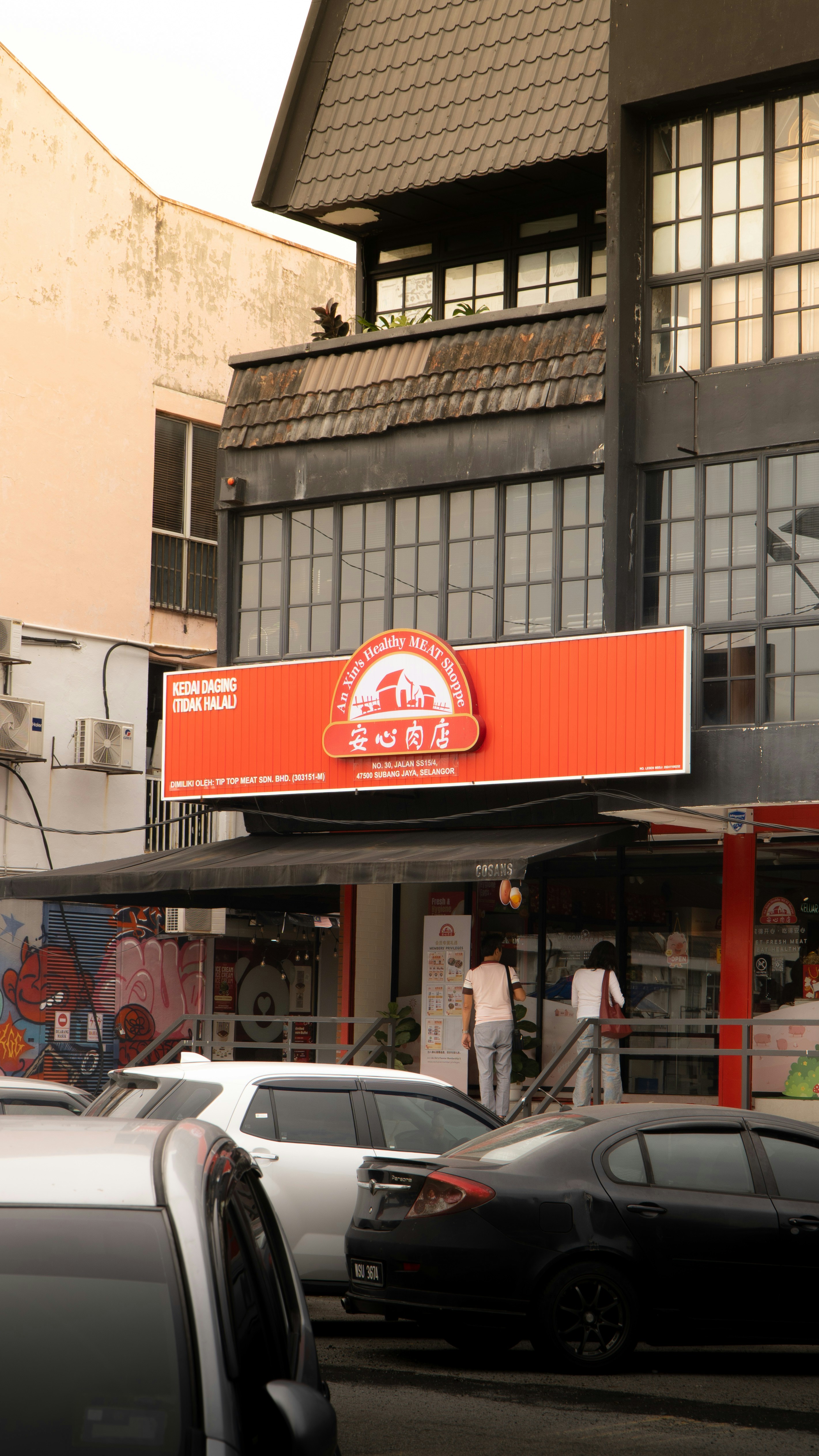 Red Signage Awakens the Alleyfront
