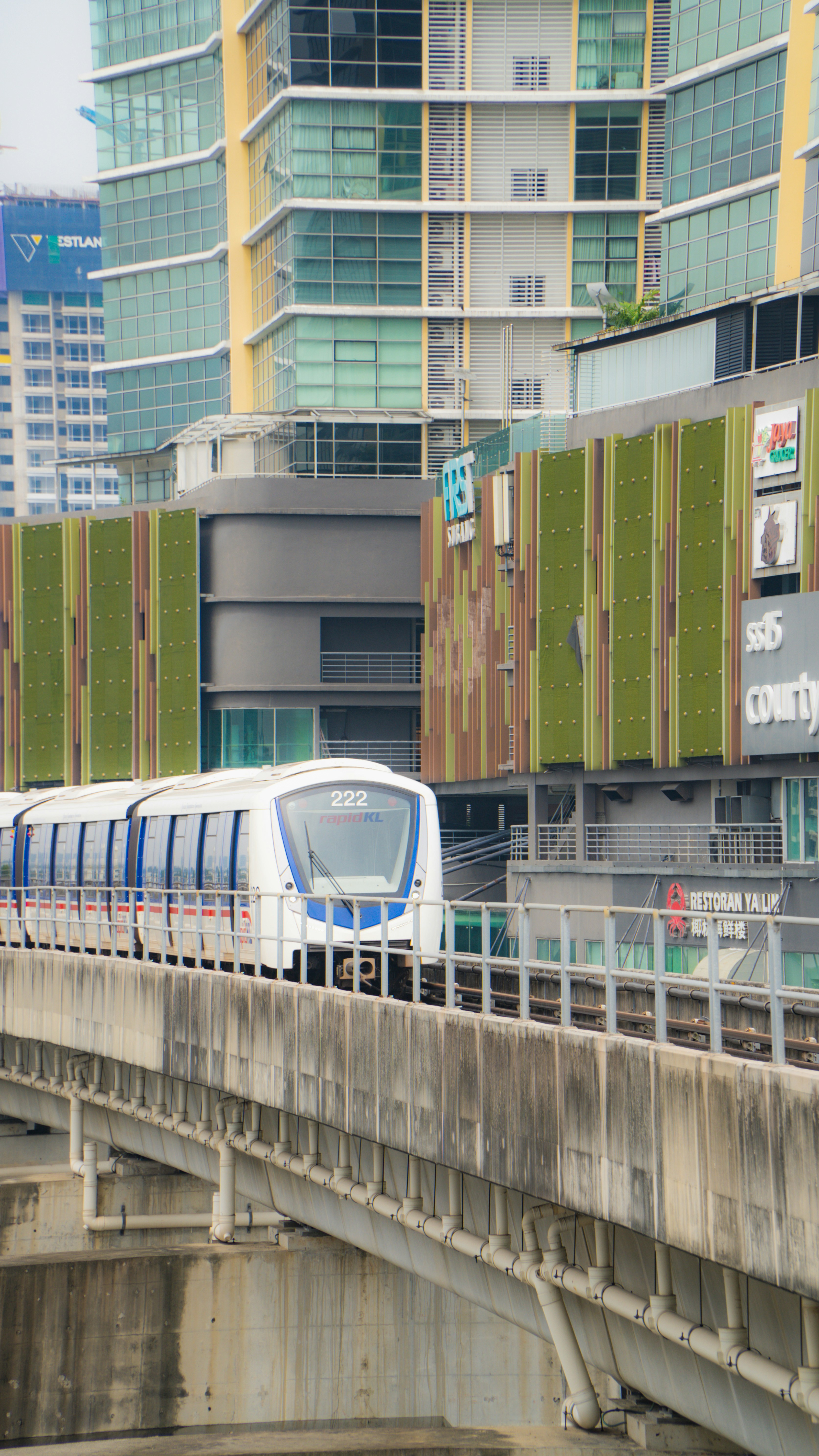 Transit Arc: A Blue Line Glides Through a Modern City Spine
