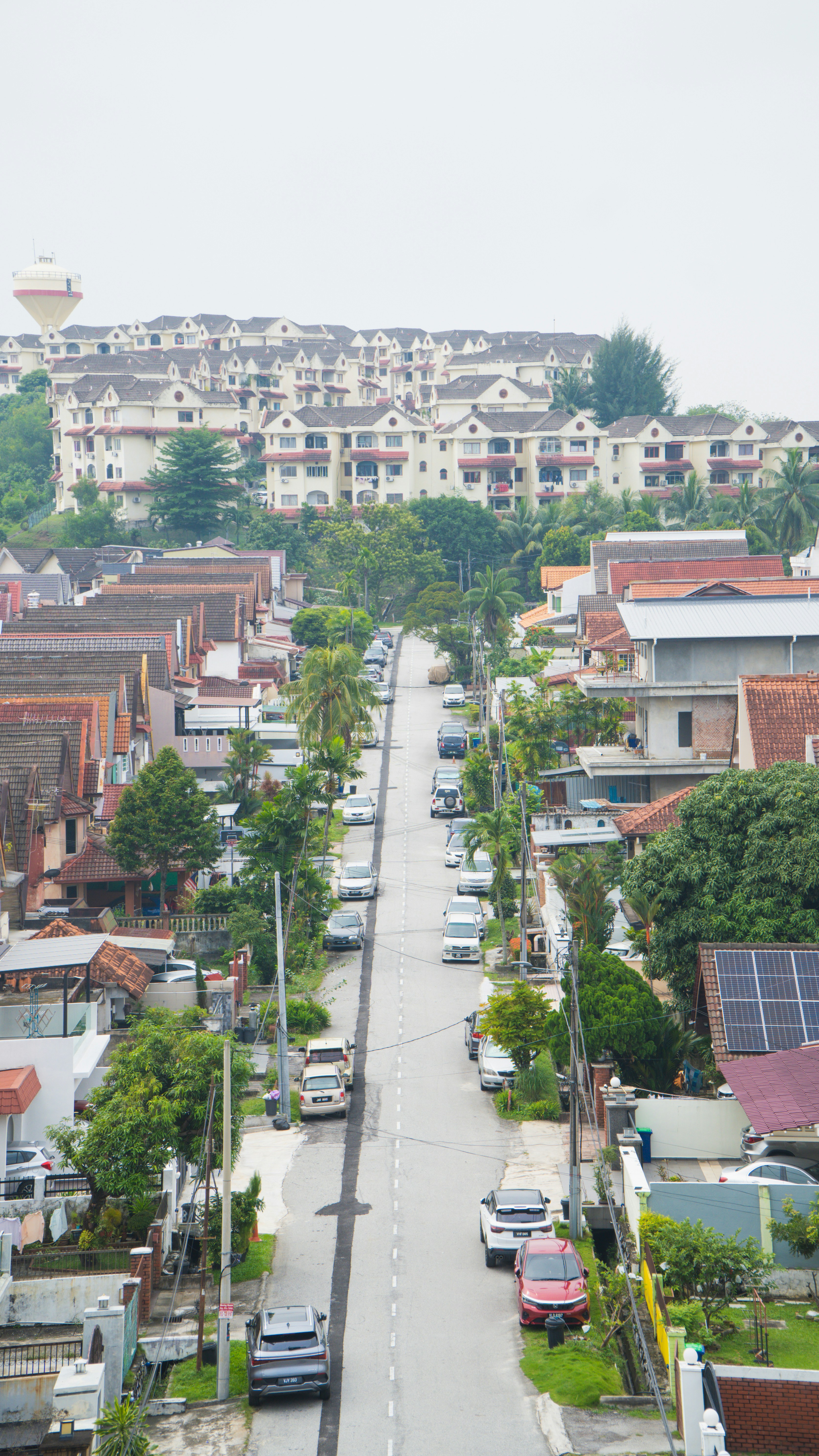 A Sunlit Street Descends Through a Coastal-Escape Village