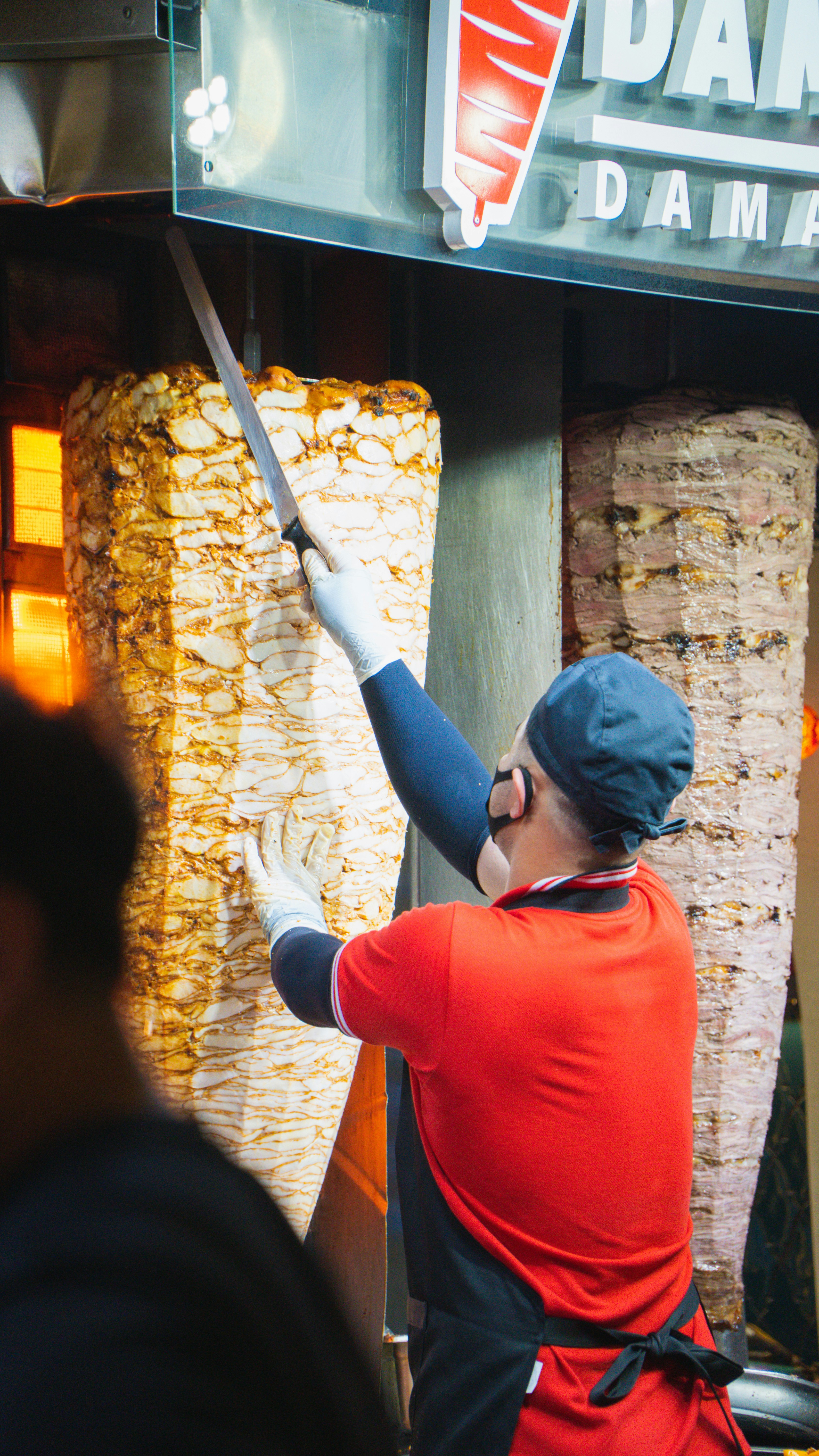 Skewer in Action: A Pit Master at the Roast
