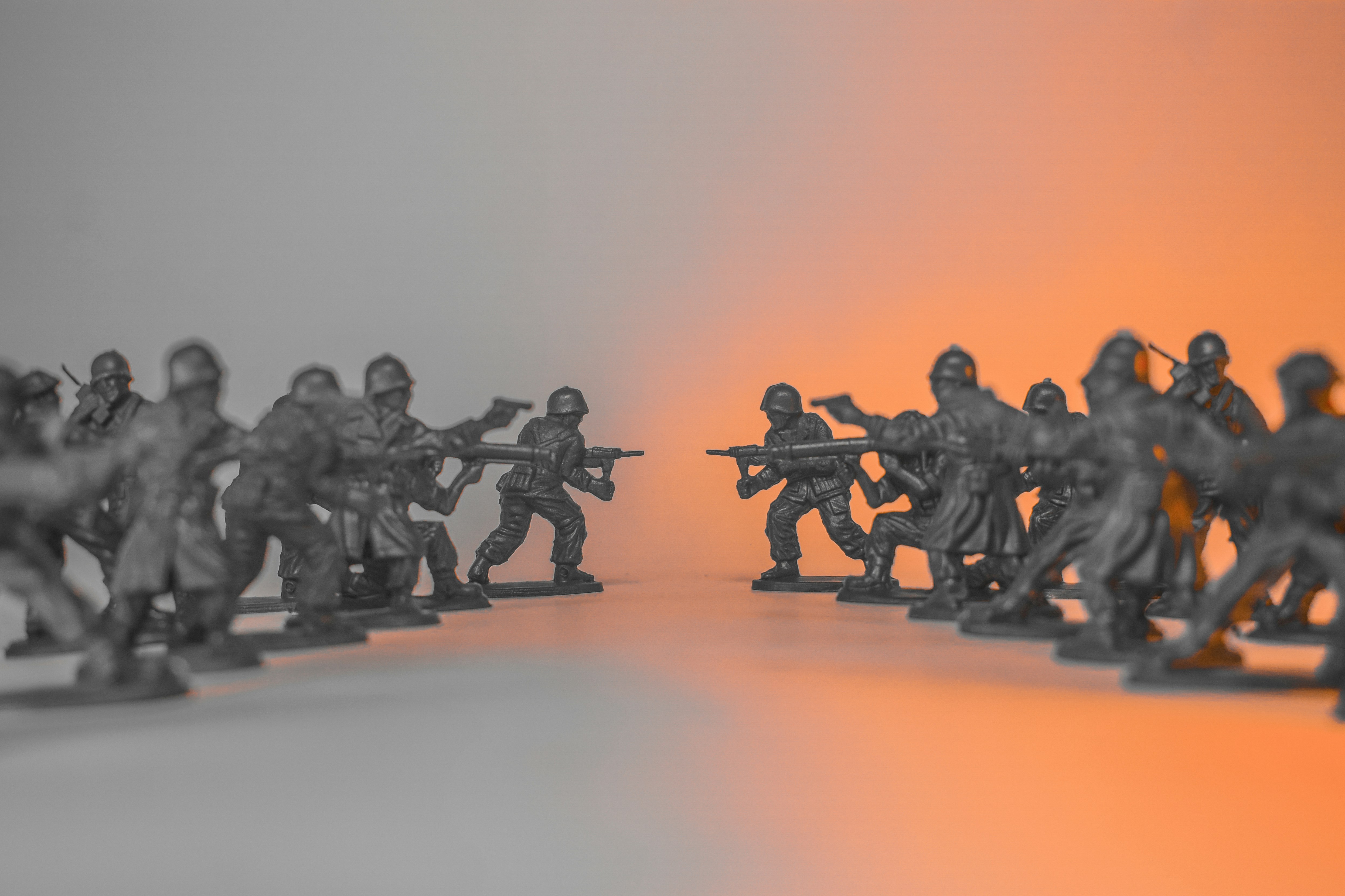 Troops in Tilt: A Narrow Corridor of Light Between Shadowed Figures