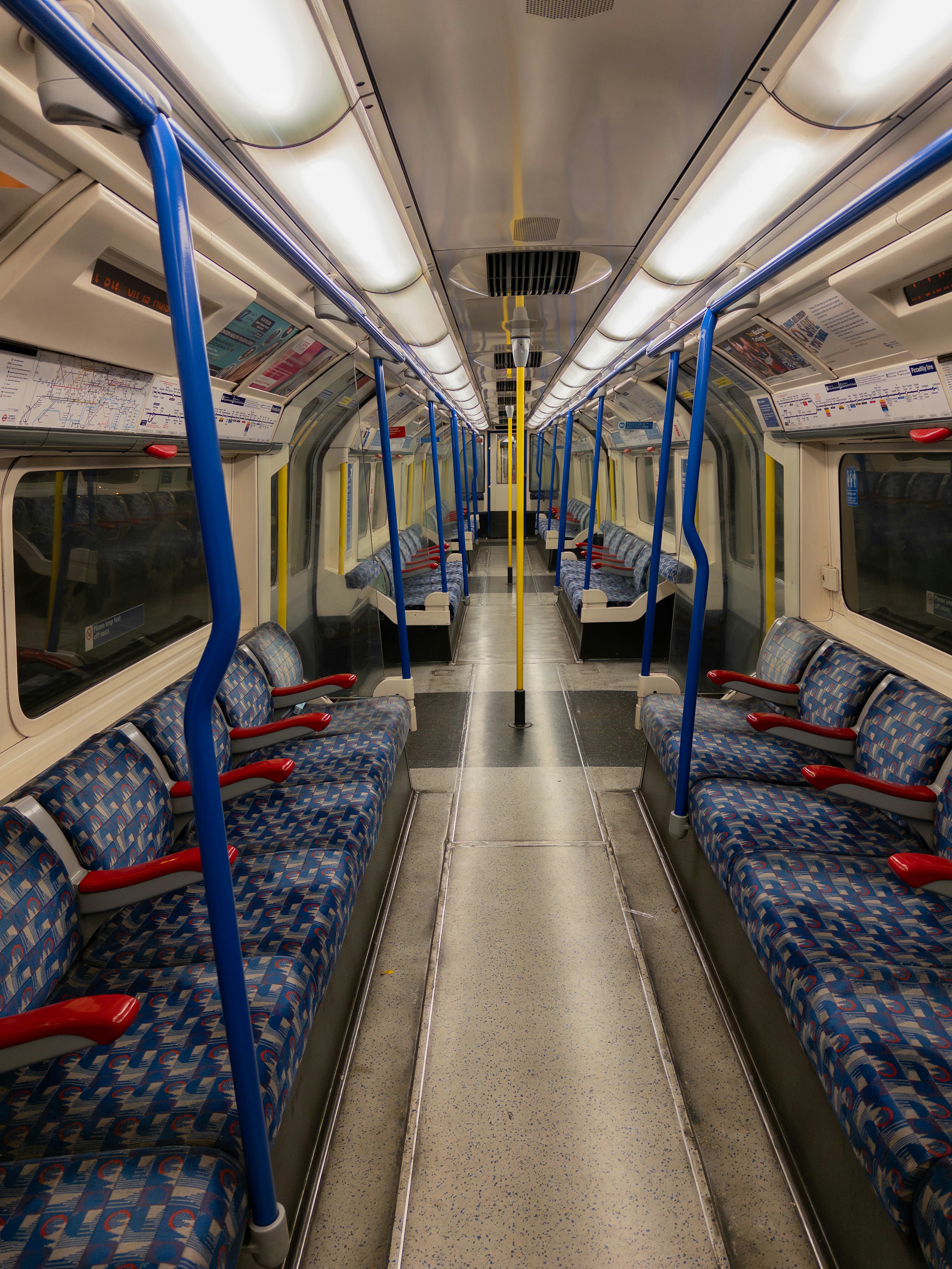 Symmetrical aisle in a deserted metro car