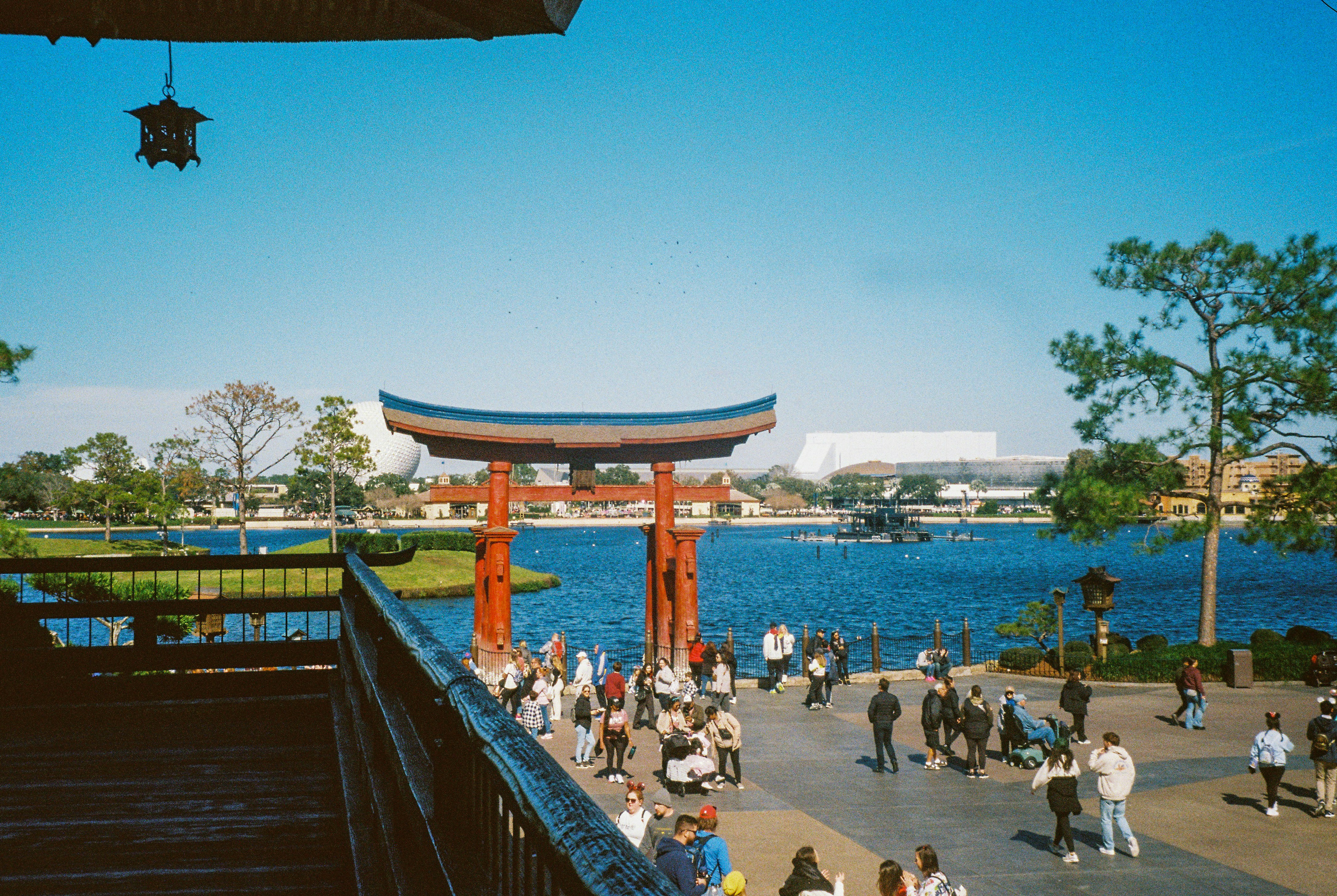 People walking near a japanese torii gate by the water photo – Free ...