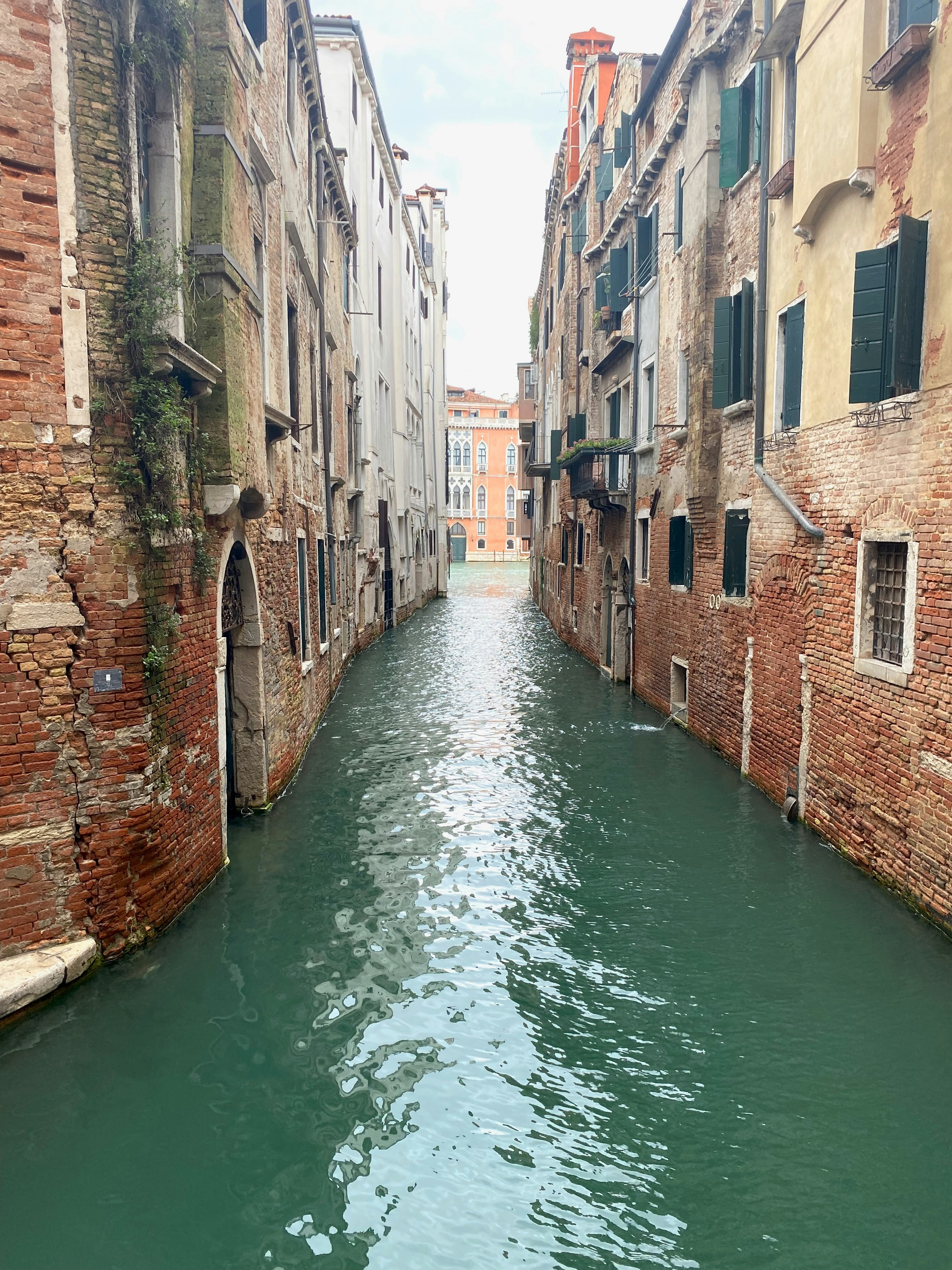 Quiet Canal Between Timeworn Facades