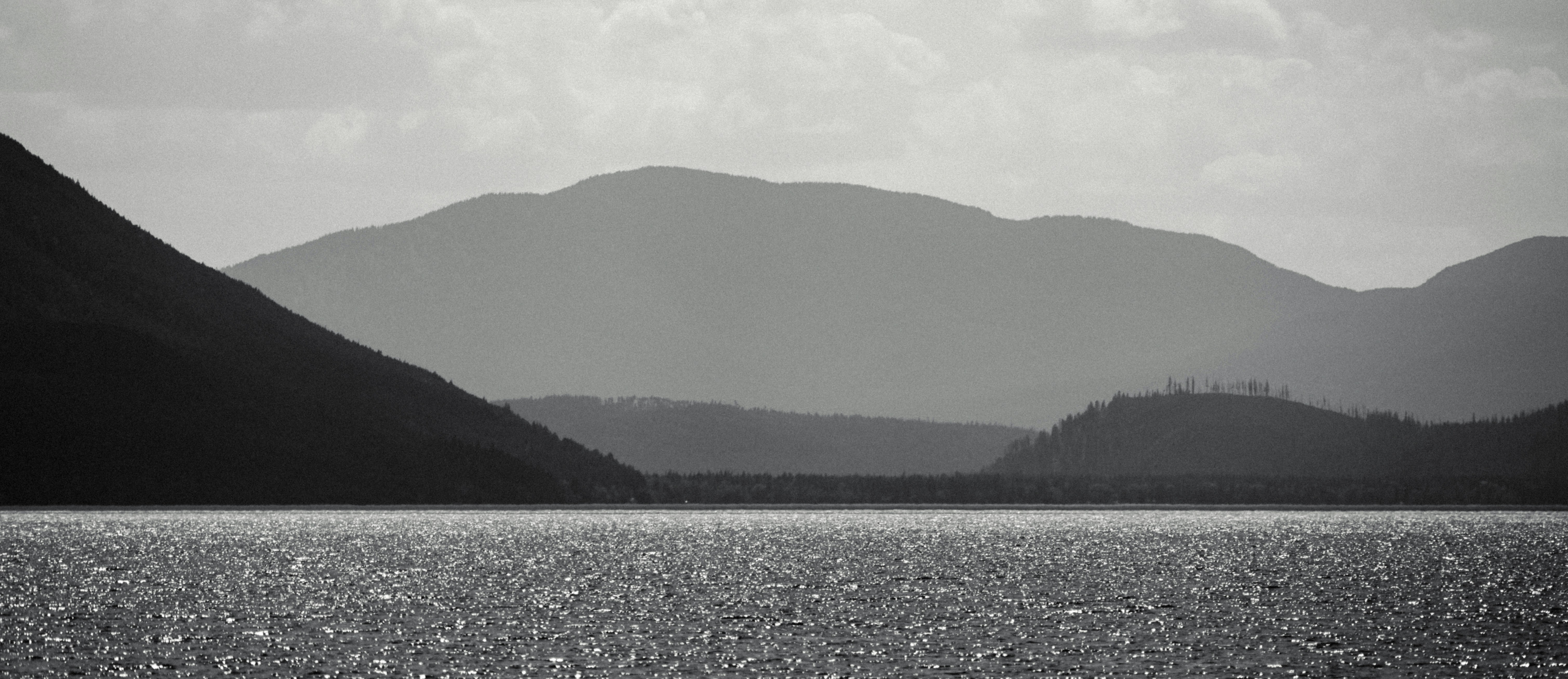 Glassy Highlands: A Quiet Pierce Across the Water
