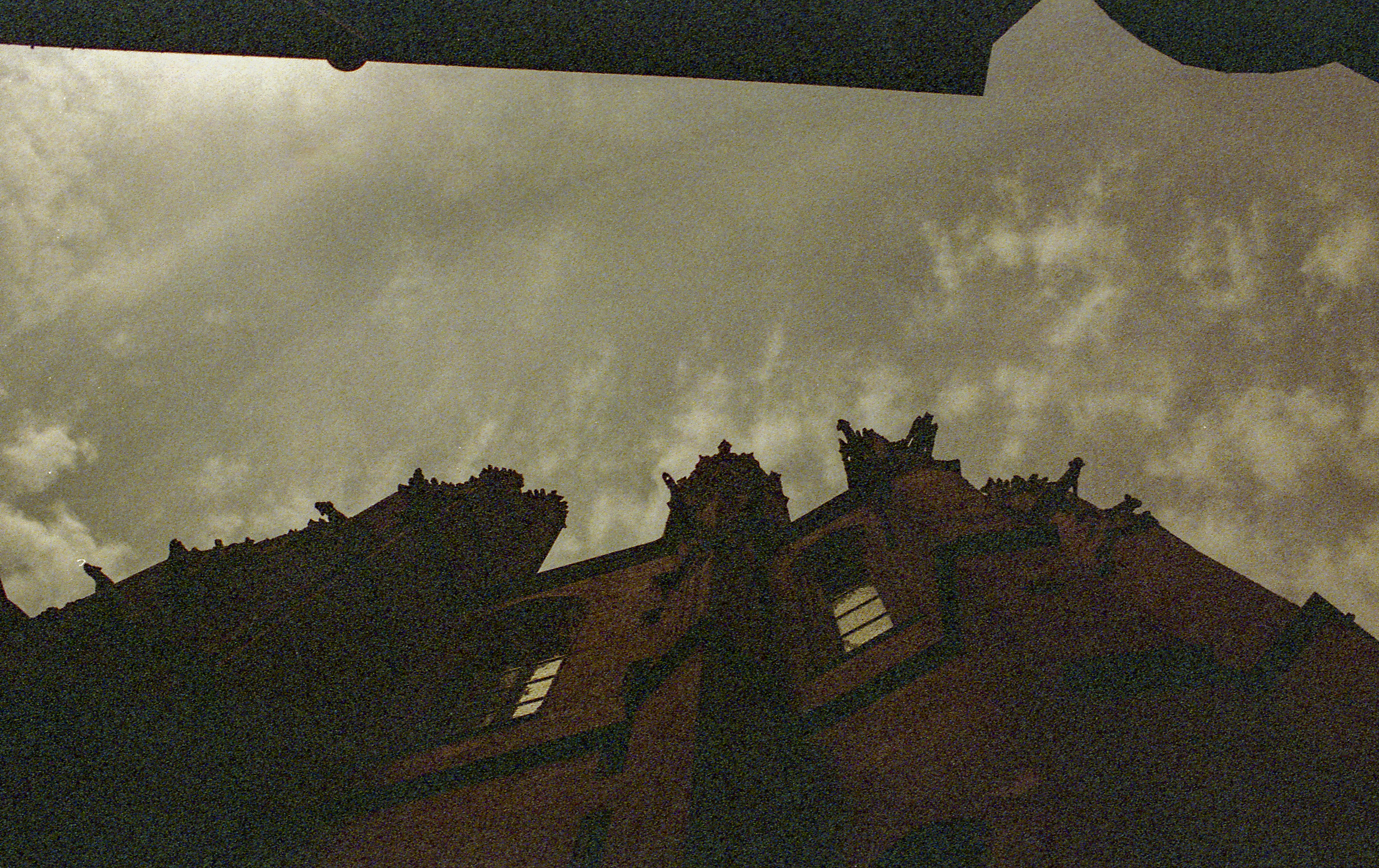 A gothic building against a cloudy sky