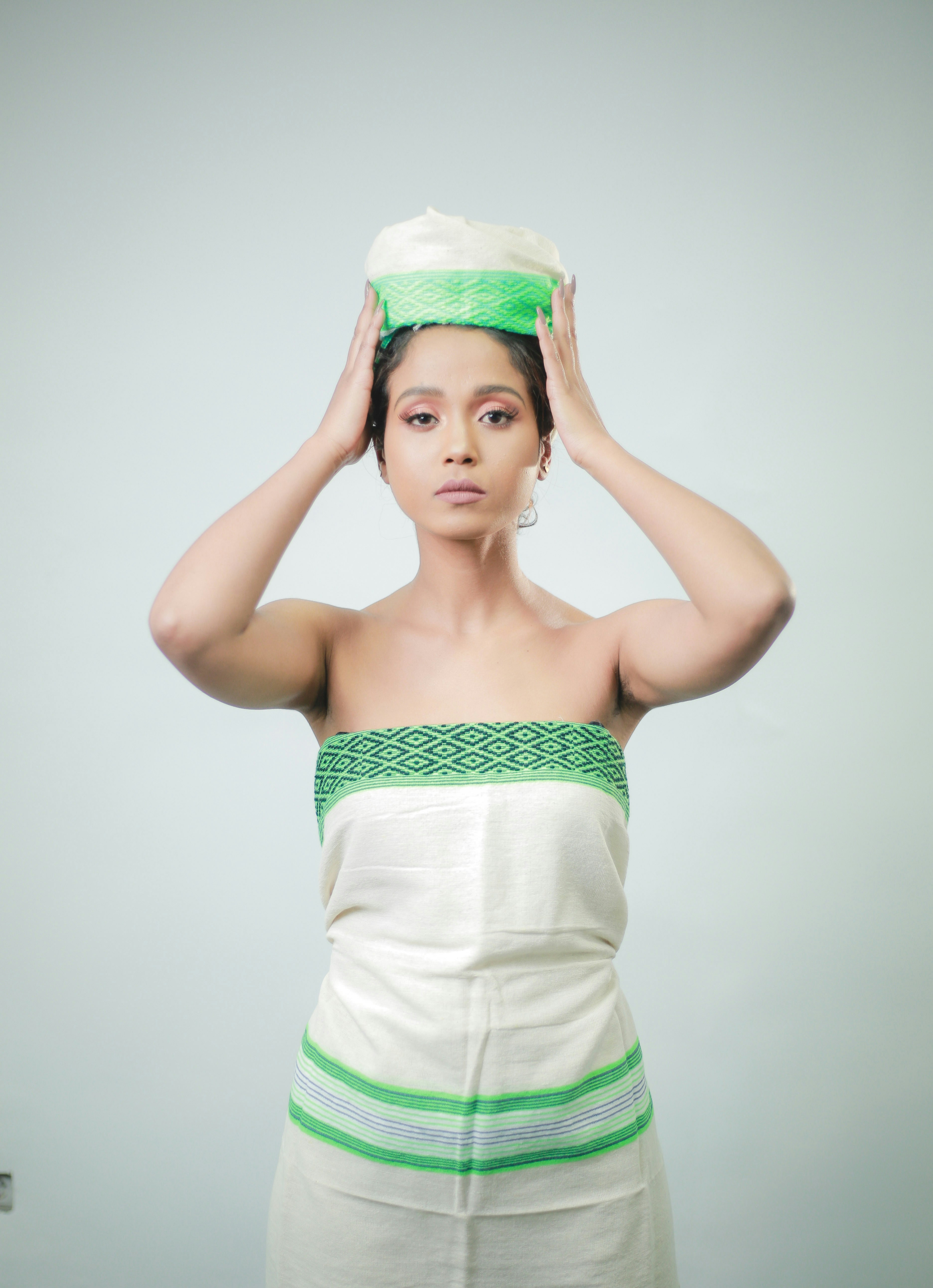 Green Crest: A Portrait of Poise in Traditional Wrap