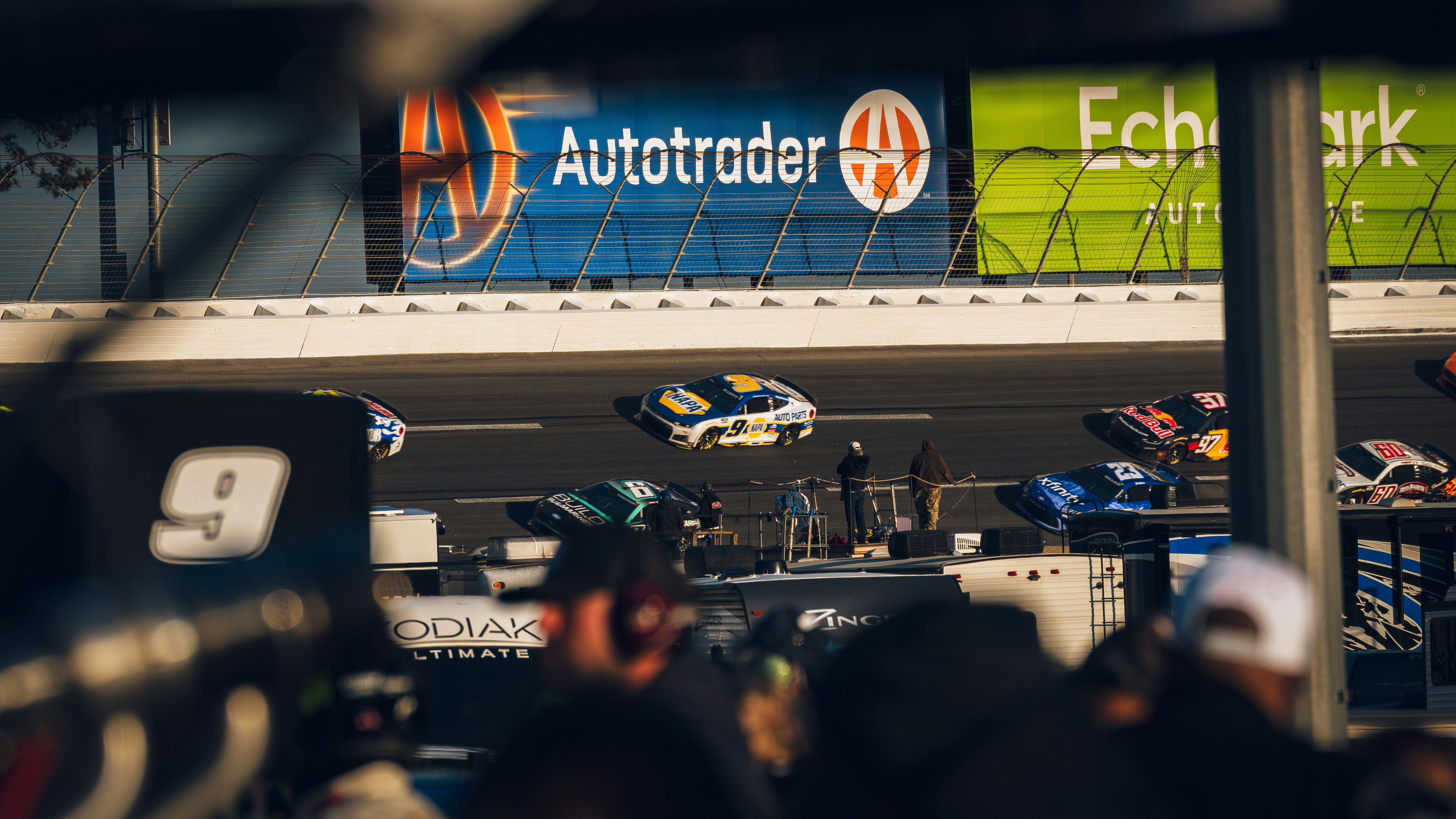 Sprint to the Turn: Cars Races Past the Grandstand