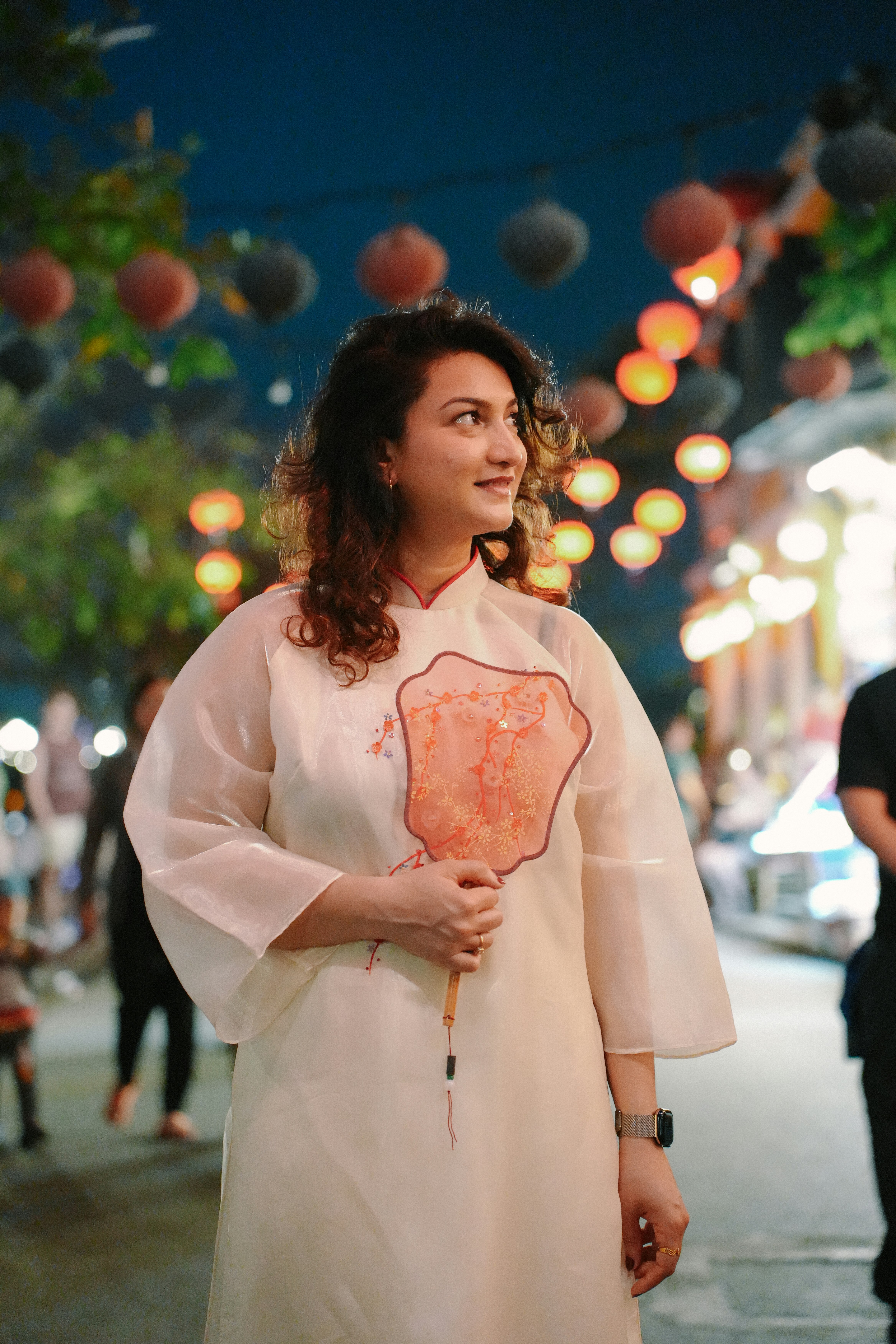 Lantern-lit City Calm: A Woman in a White Dress Walks Through Night Market