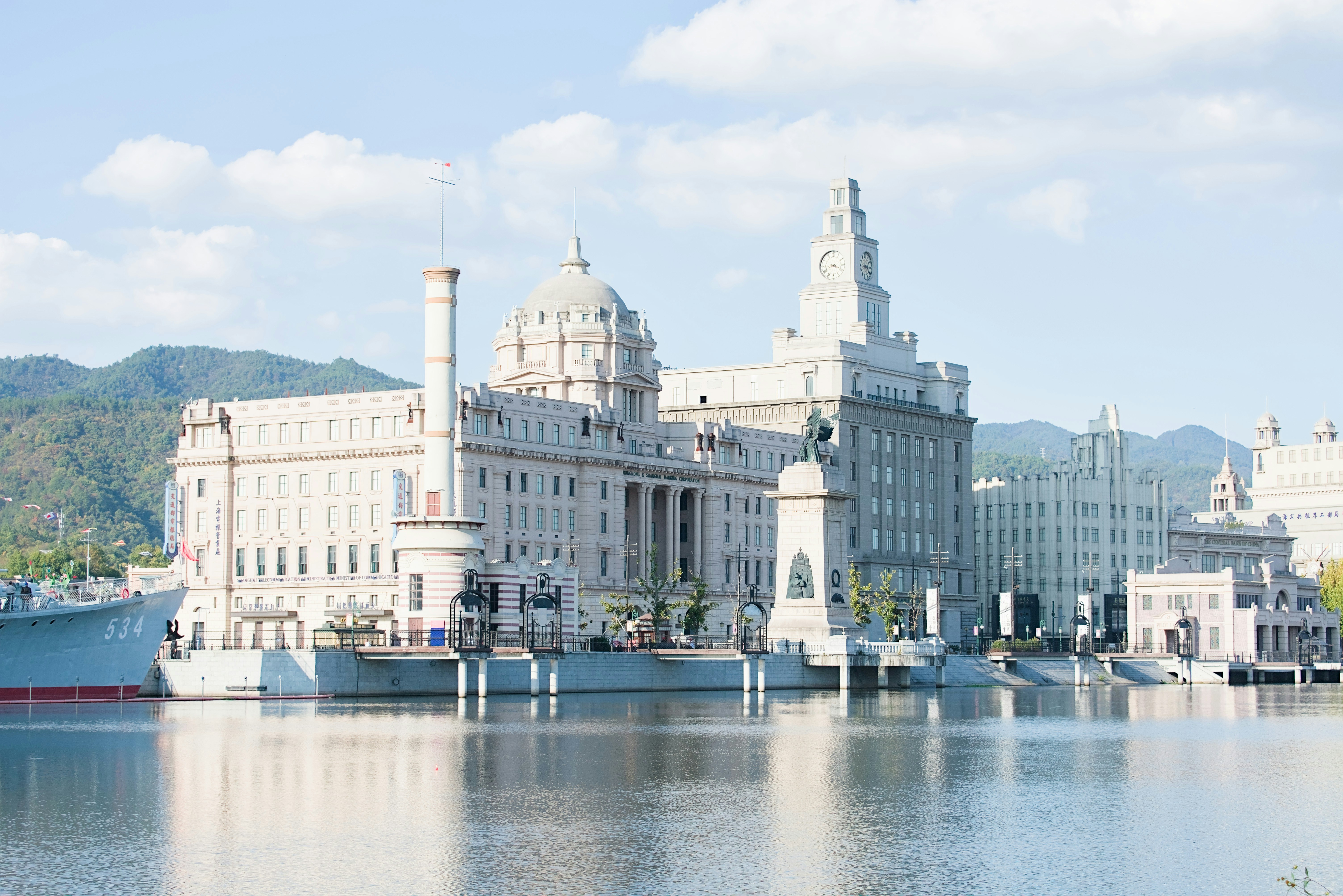 Neoclassical Harbor Complex Rising from Calm Waters