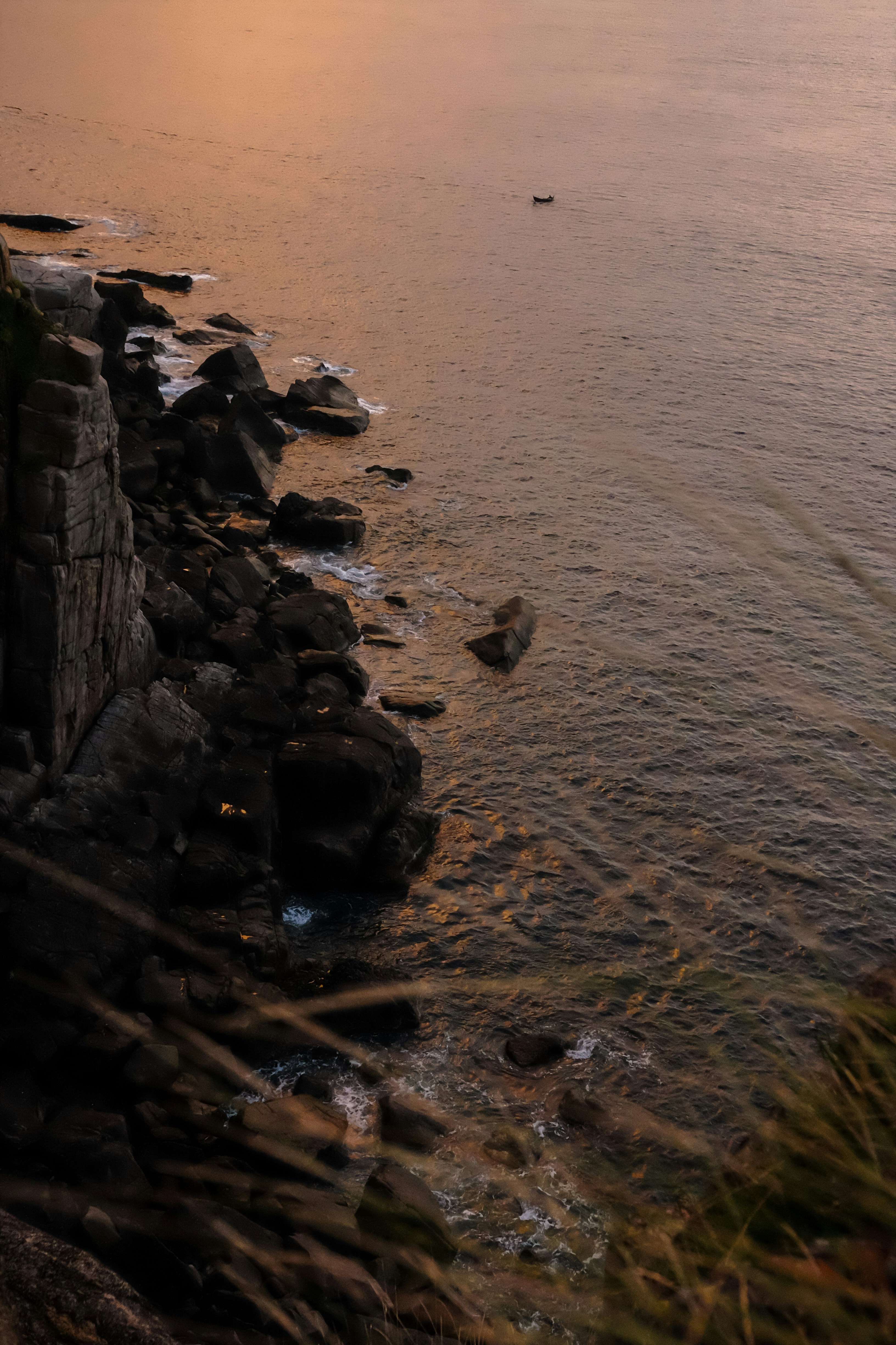 Sunset Over Weathered Cloffs: Rocks and Sea in Quiet Tide